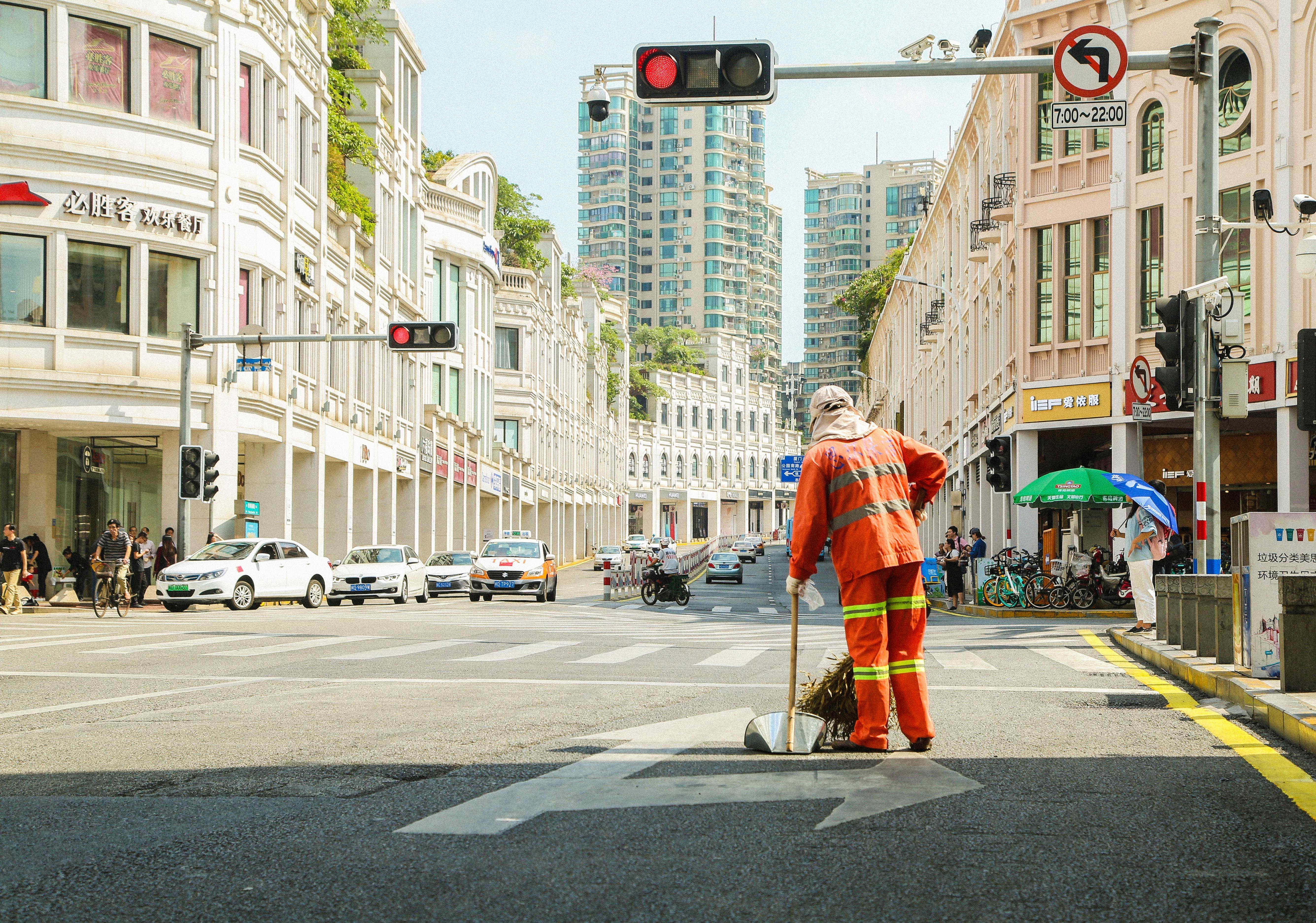 Cleaner Cleaning Street in City · Free Stock Photo