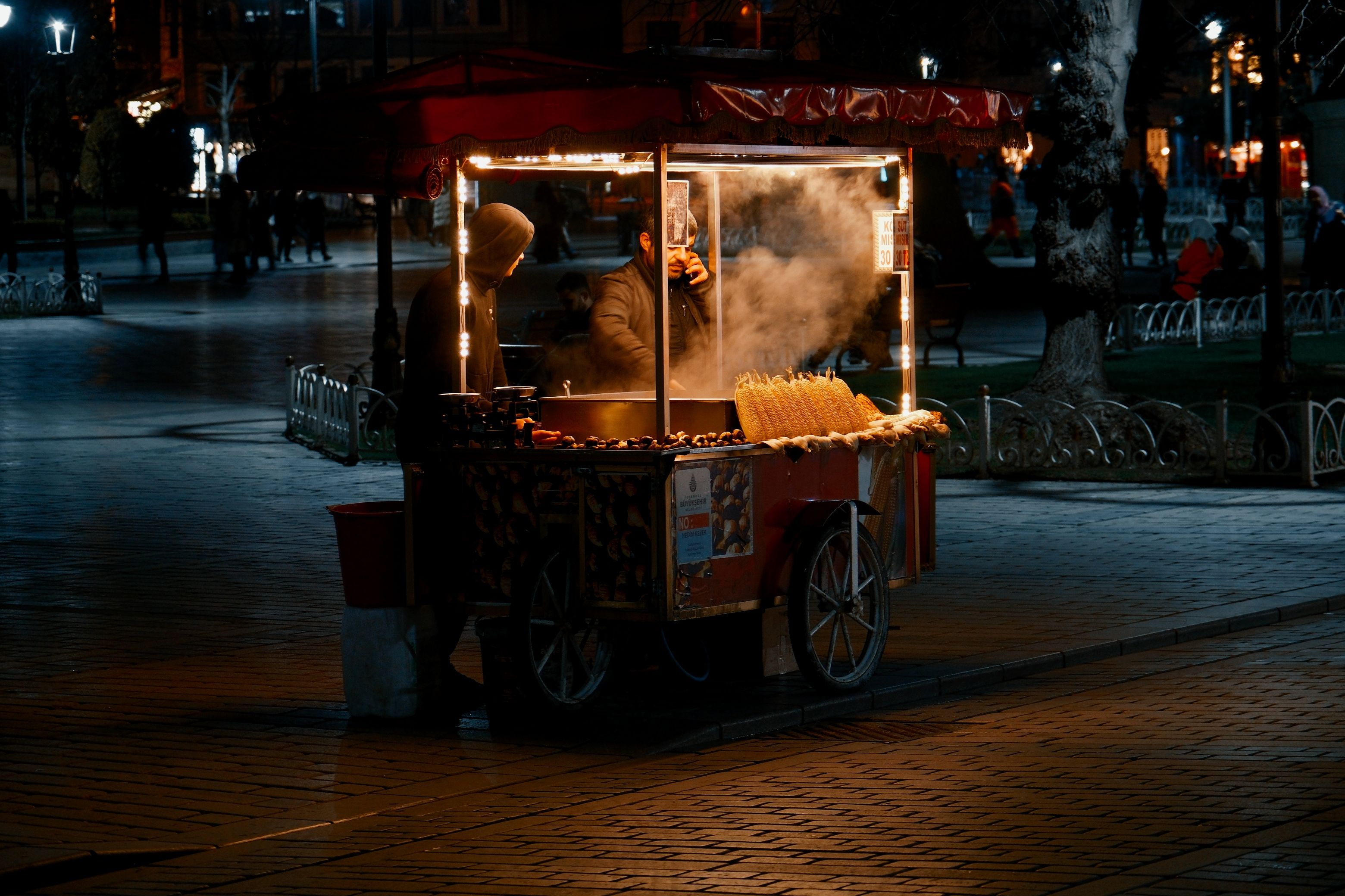 A food cart is lit up at night · Free Stock Photo