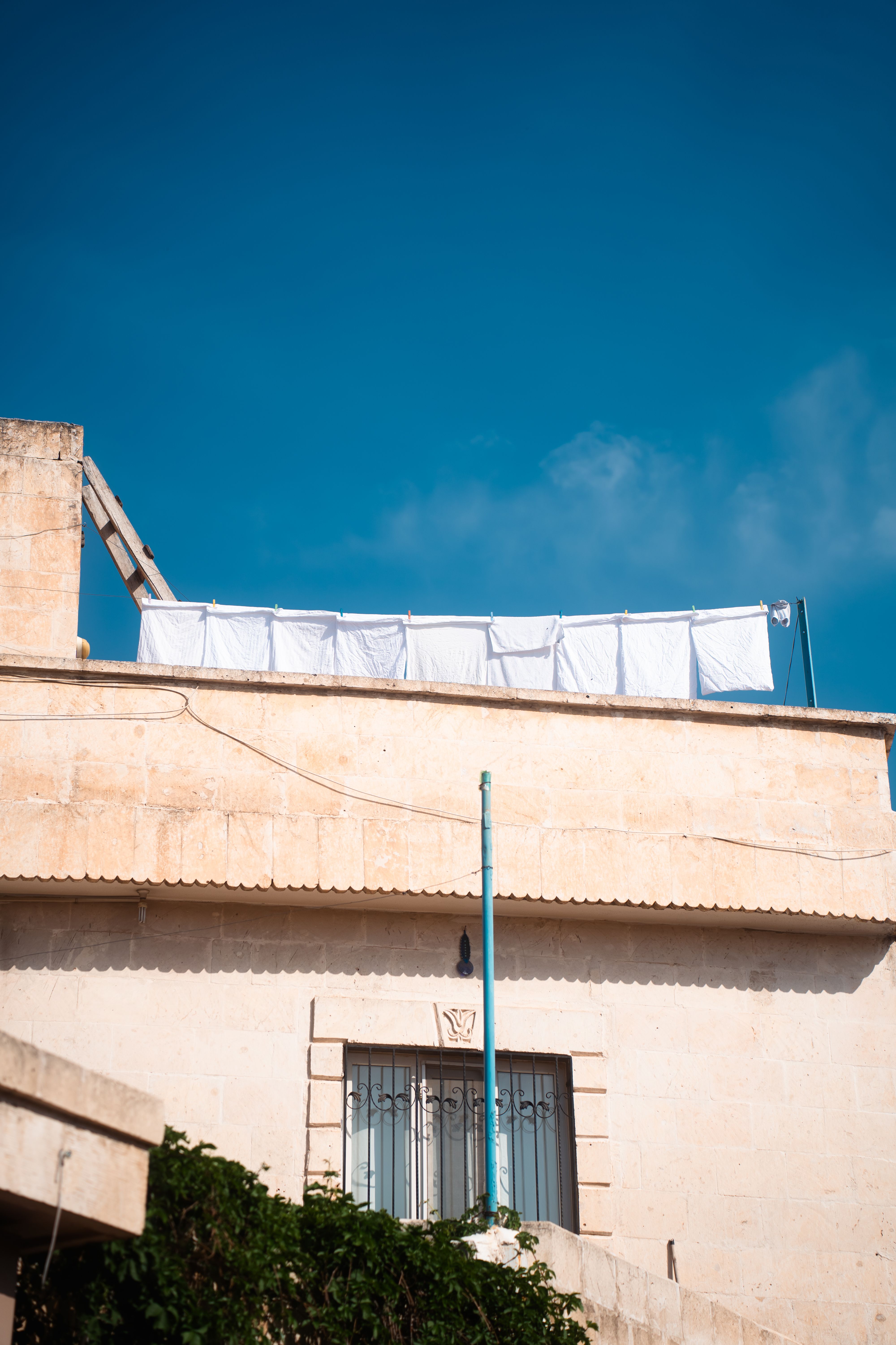 Laundry Air Drying on Rooftop Patio · Free Stock Photo