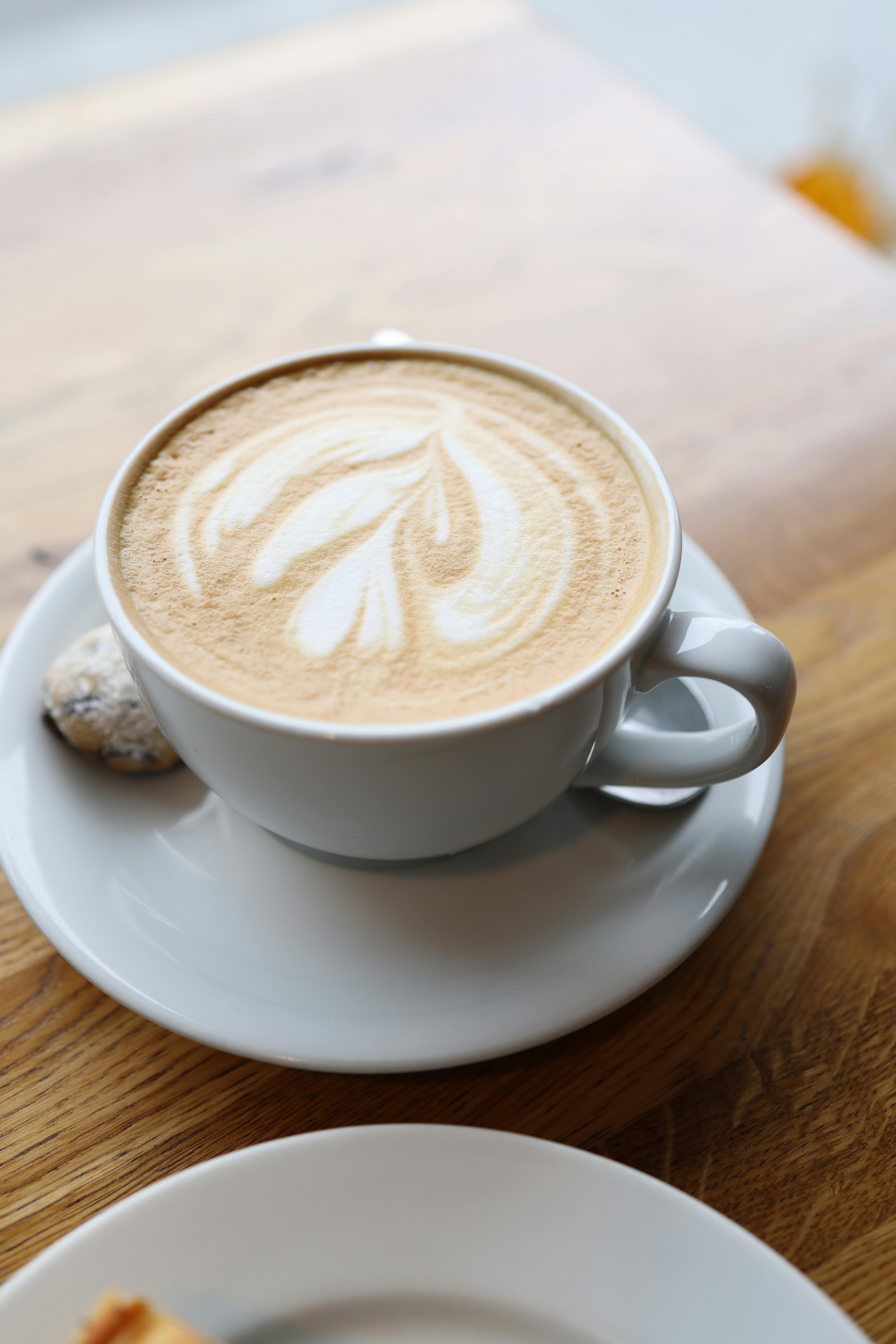 Cup Of Coffee On A Wooden Table · Free Stock Photo