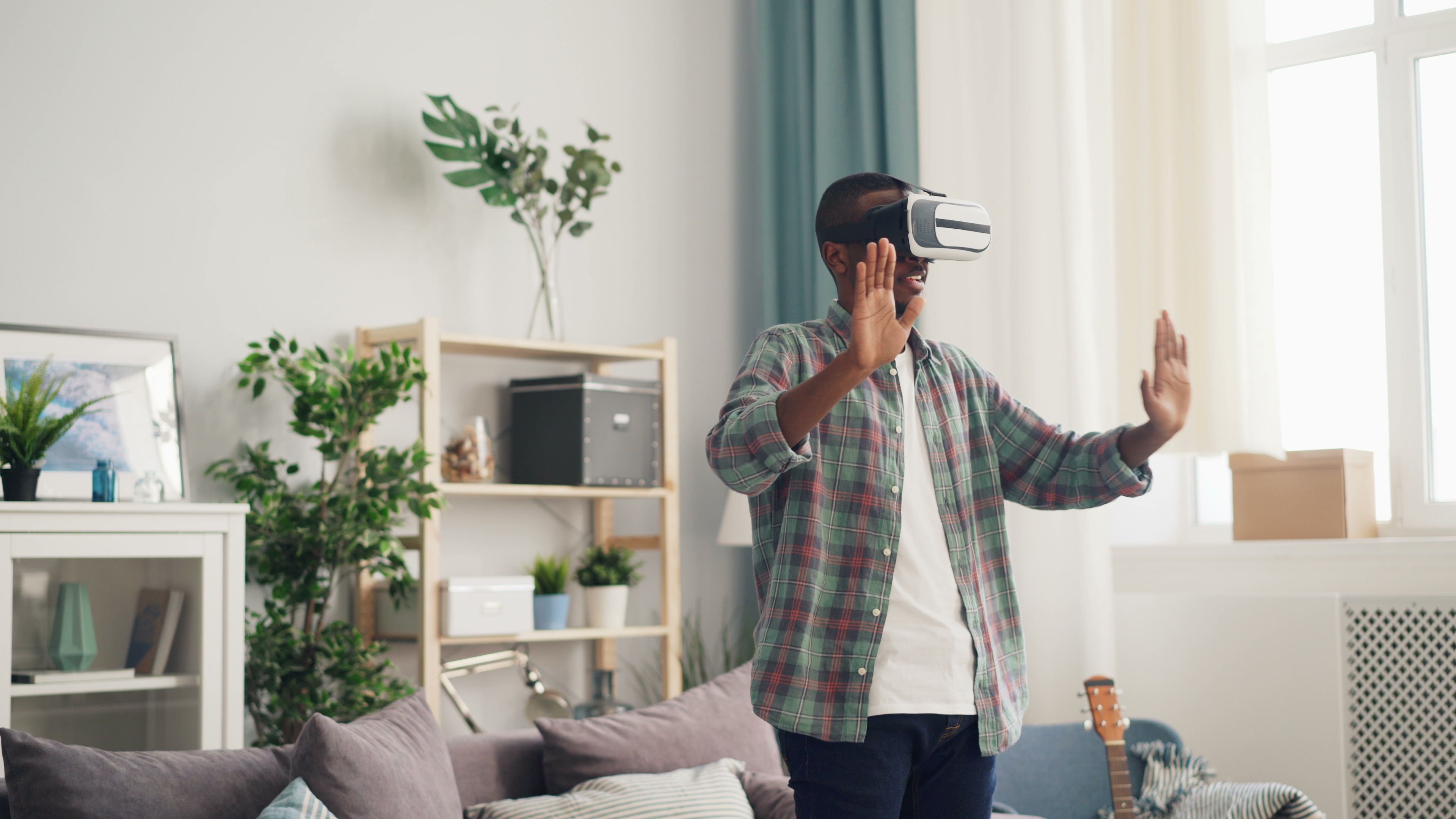 Man in Virtual Reality Goggles in Room · Free Stock Photo