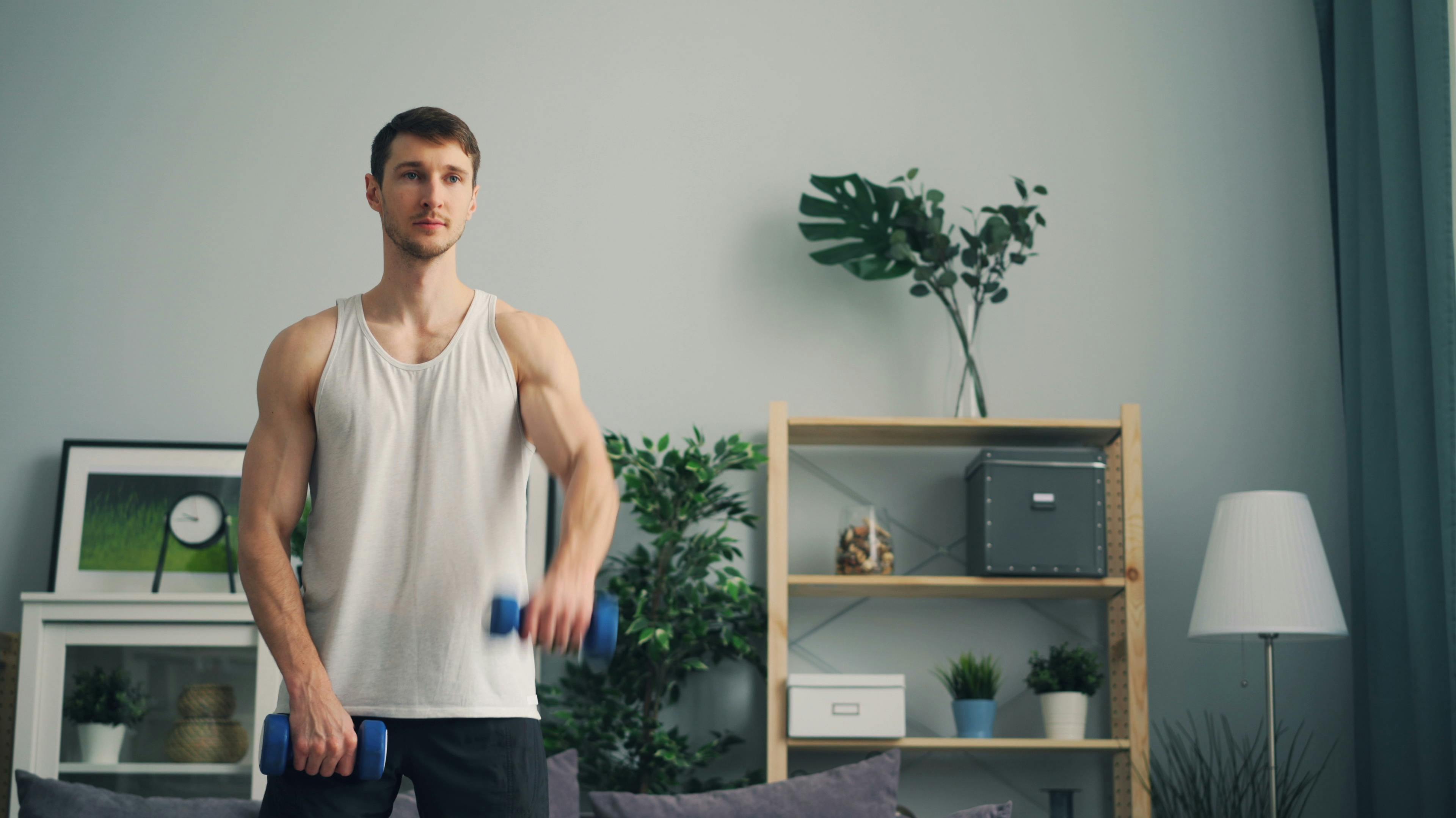 Man in Tank Top Exercising with Dumbbells · Free Stock Photo