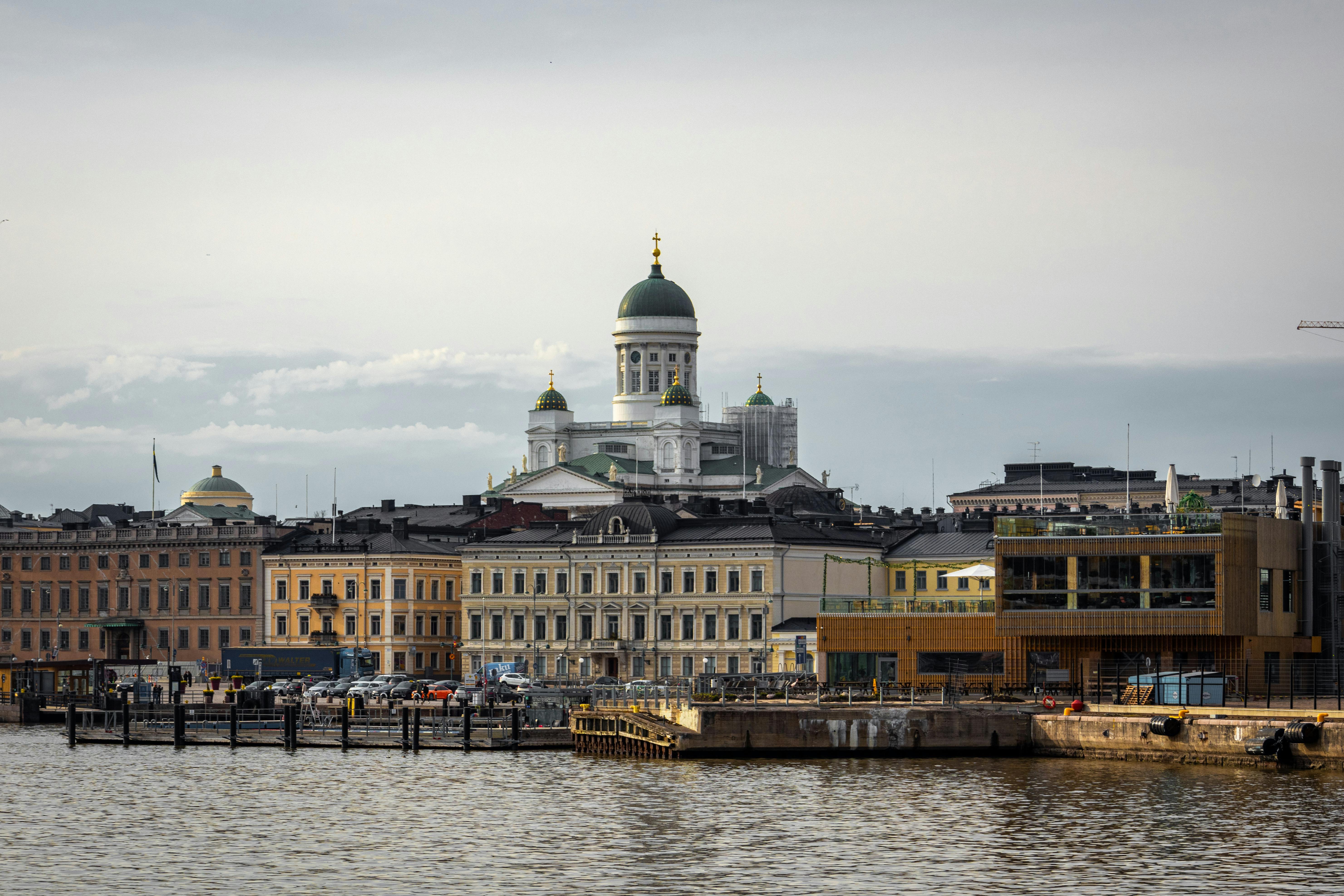 Photo of Cathedral Near Buildings and River · Free Stock Photo