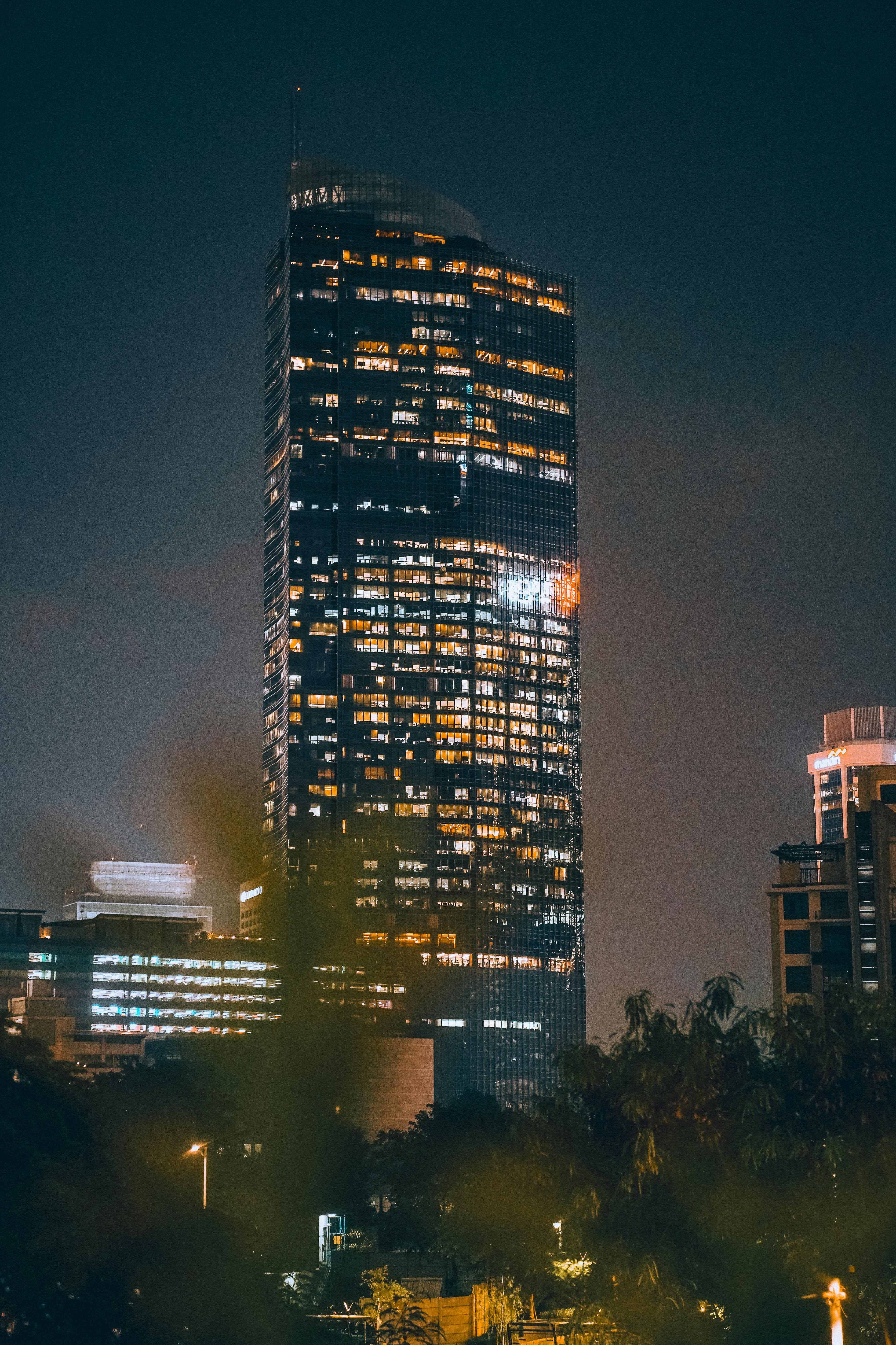 Illuminated Skyscraper at Dusk · Free Stock Photo