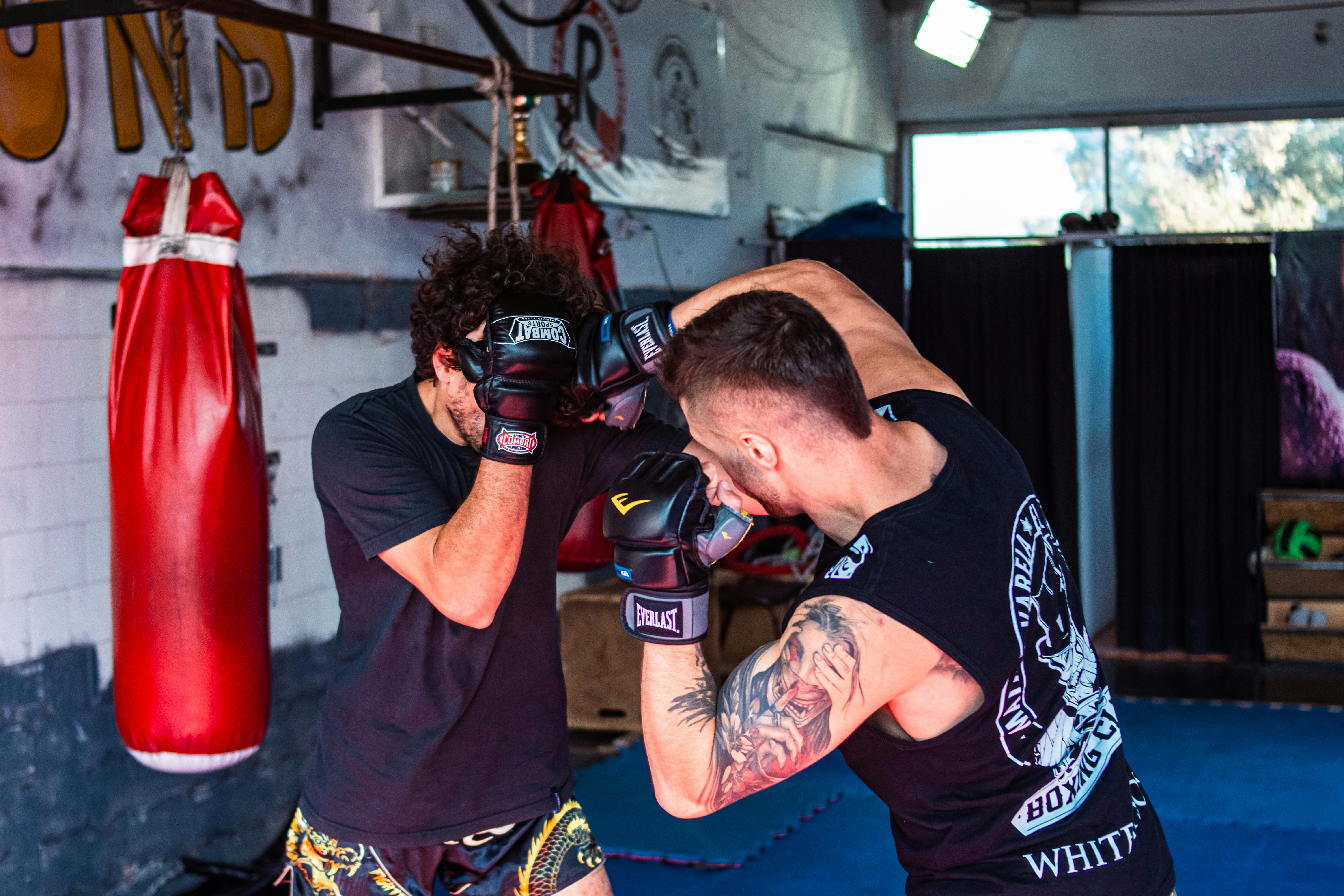Two Kickboxers Sparring in a Gym · Free Stock Photo