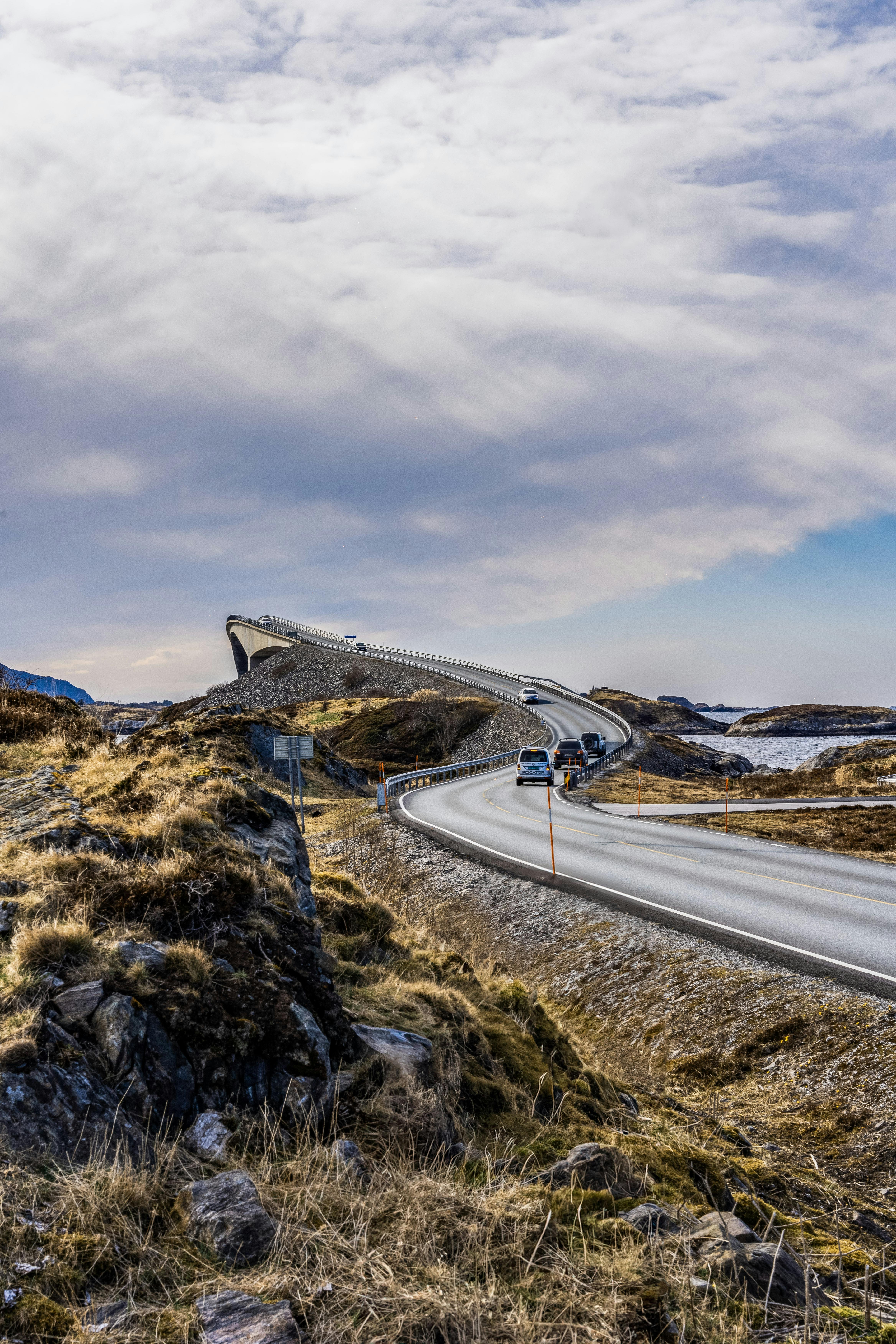 Cars on a Winding Asphalt Road in a Mountain Terrain · Free Stock Photo