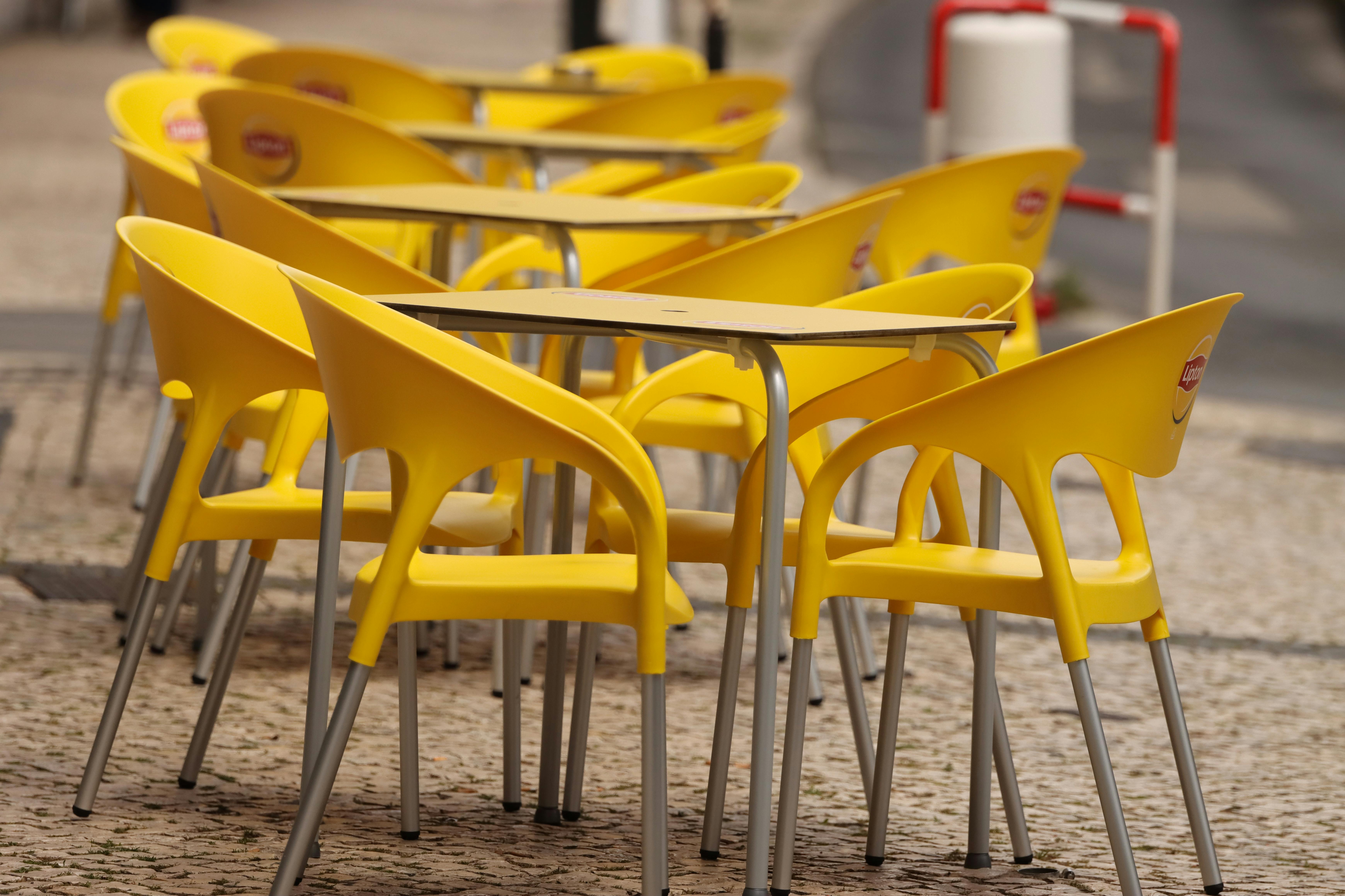 Bright Yellow Plastic Chairs and Tables on the Street · Free Stock Photo