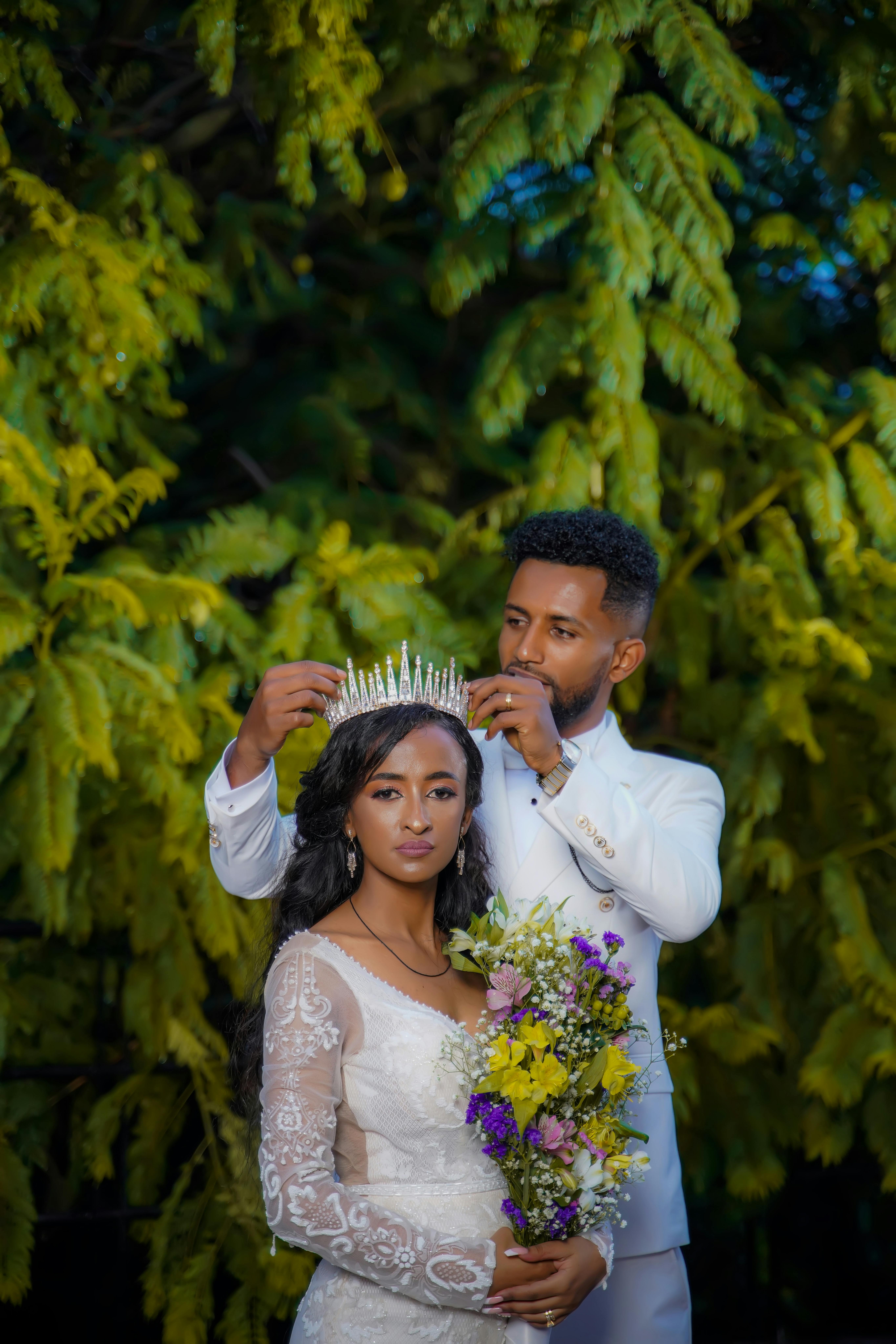 Groom Placing Tiara on Head of Bride · Free Stock Photo