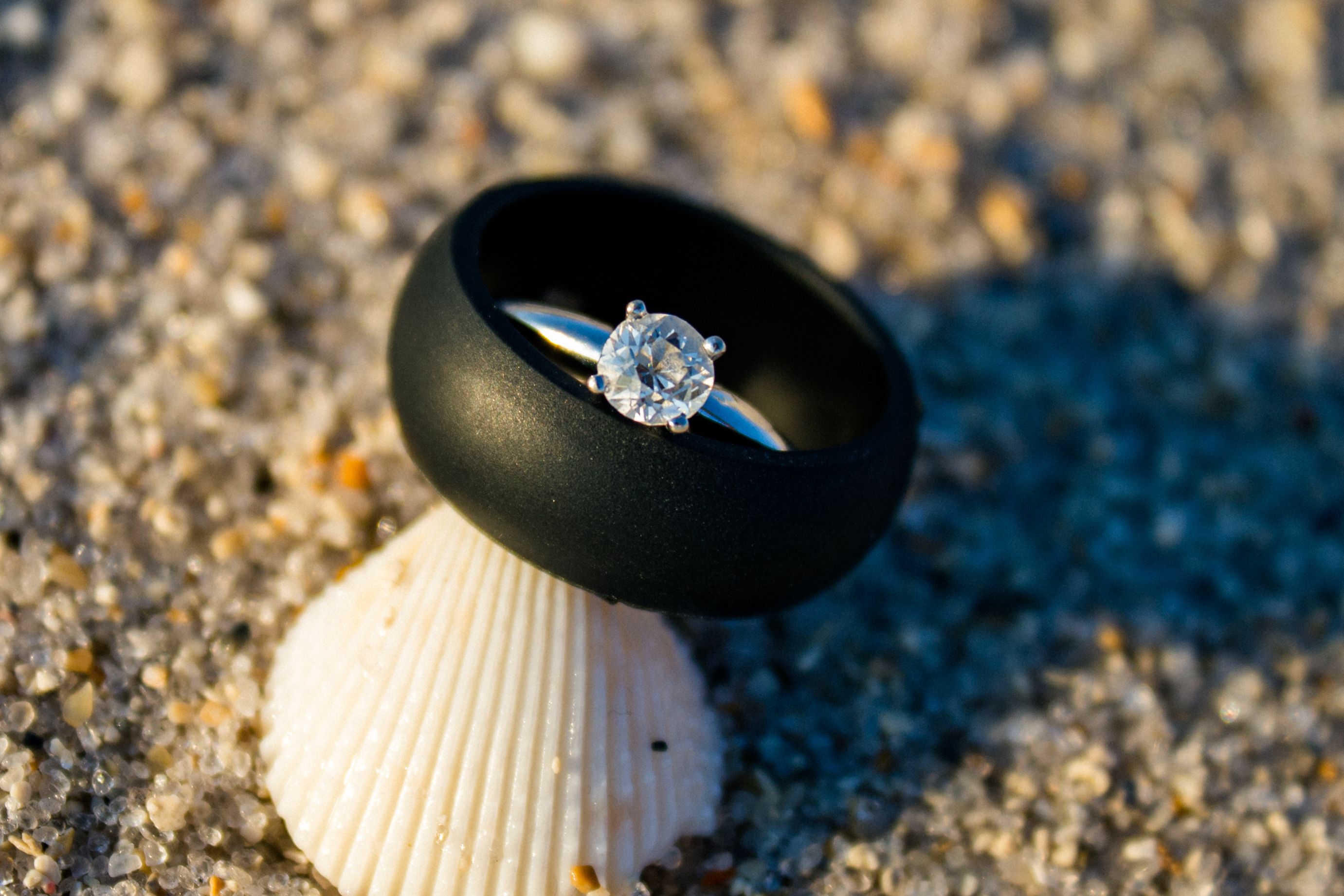 Close-up of a Diamond Ring in a Small Black Box on Shell And Sand ...