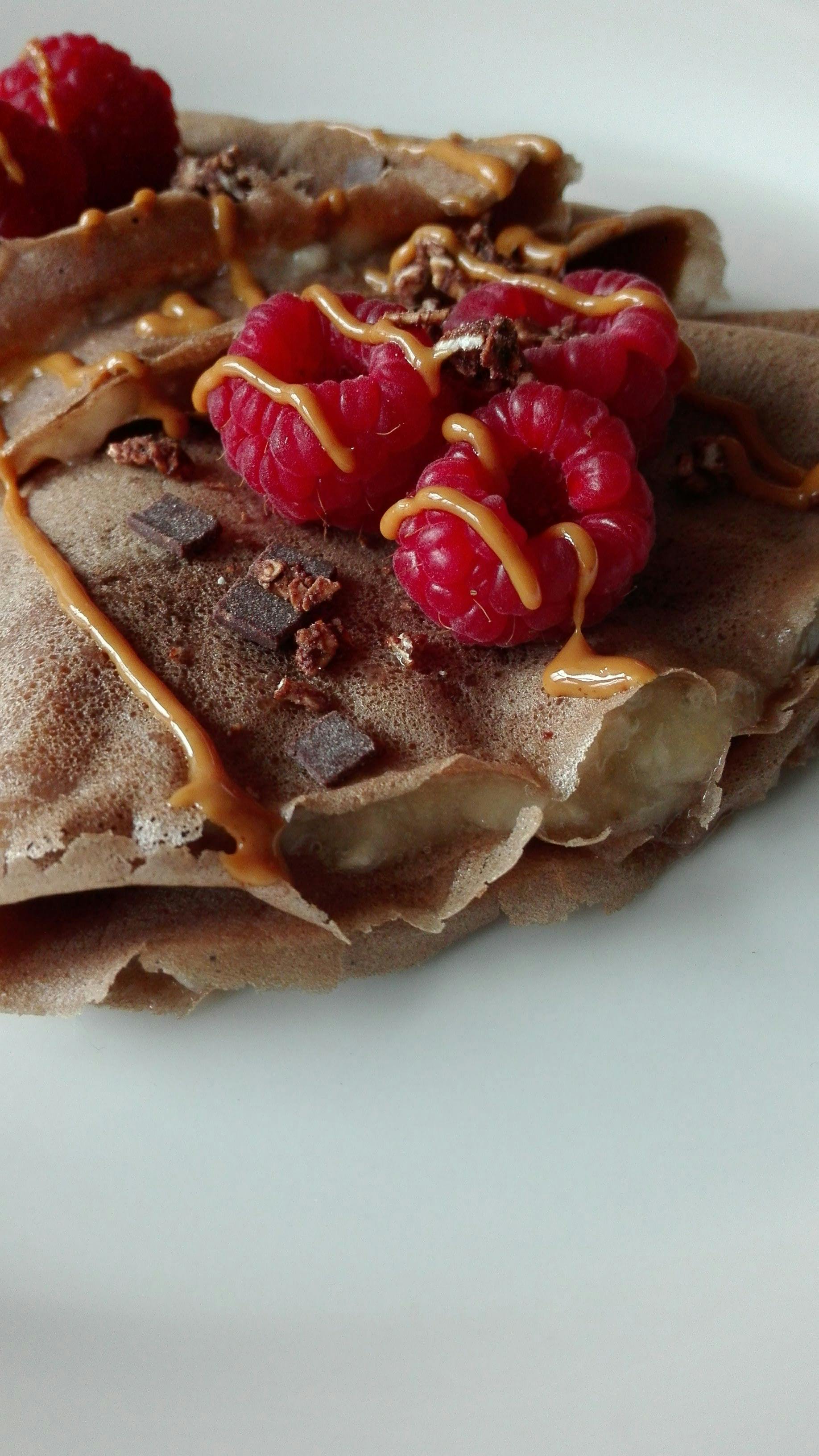 Close-up of Pankakes With Fresh Raspberries, Chocolate and Caramel ...