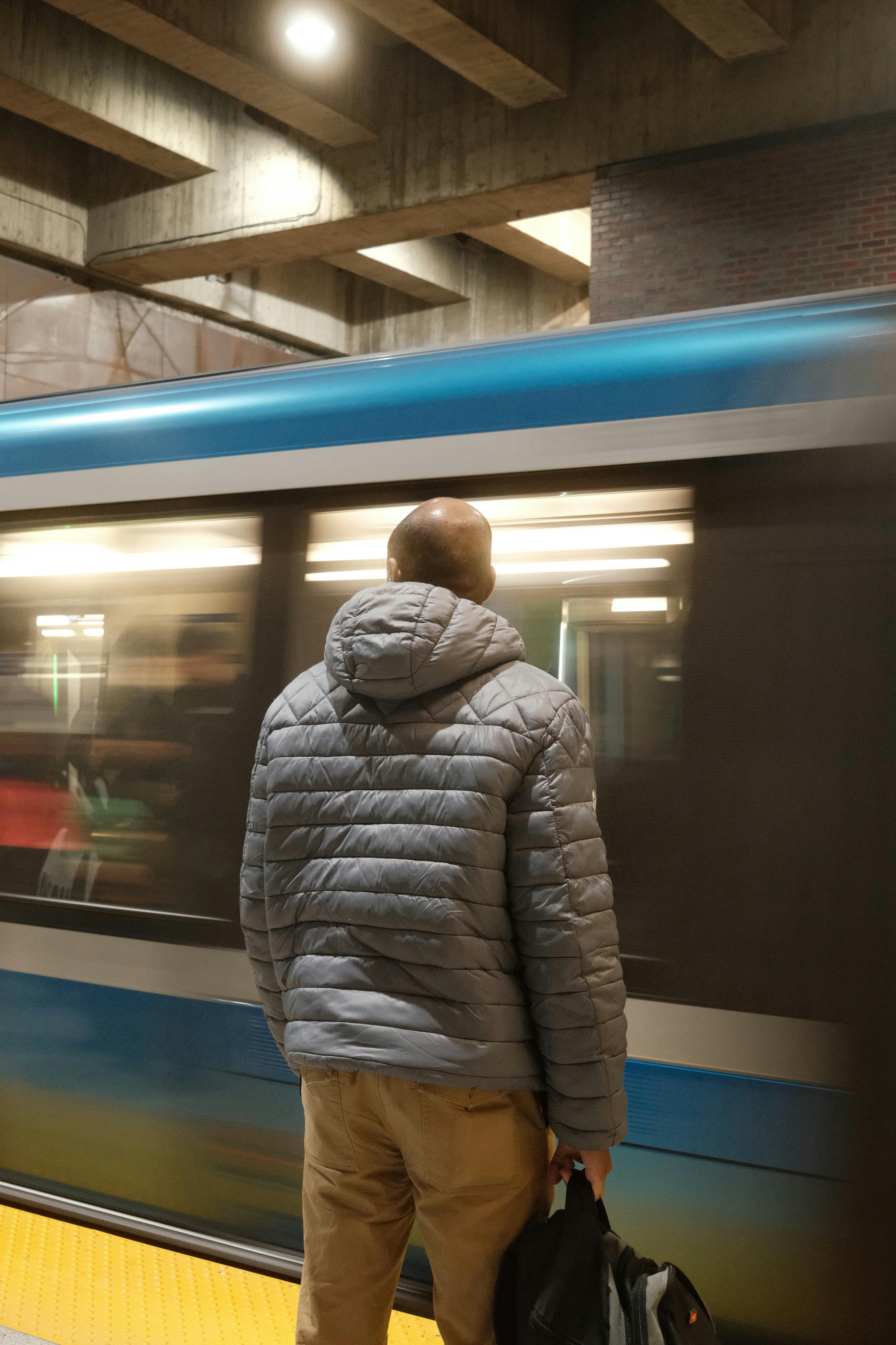 Back View of Man Standing at Subway Station next to Moving Metro · Free ...