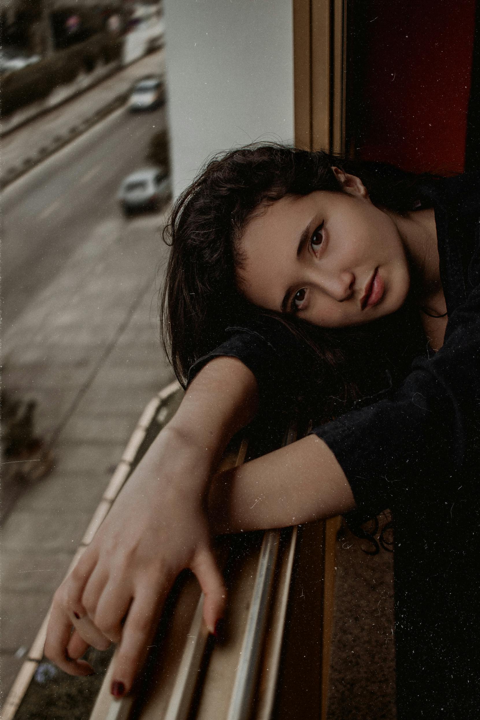 Woman Wearing Black Long Sleeve Shirt With Head On Window · Free Stock ...