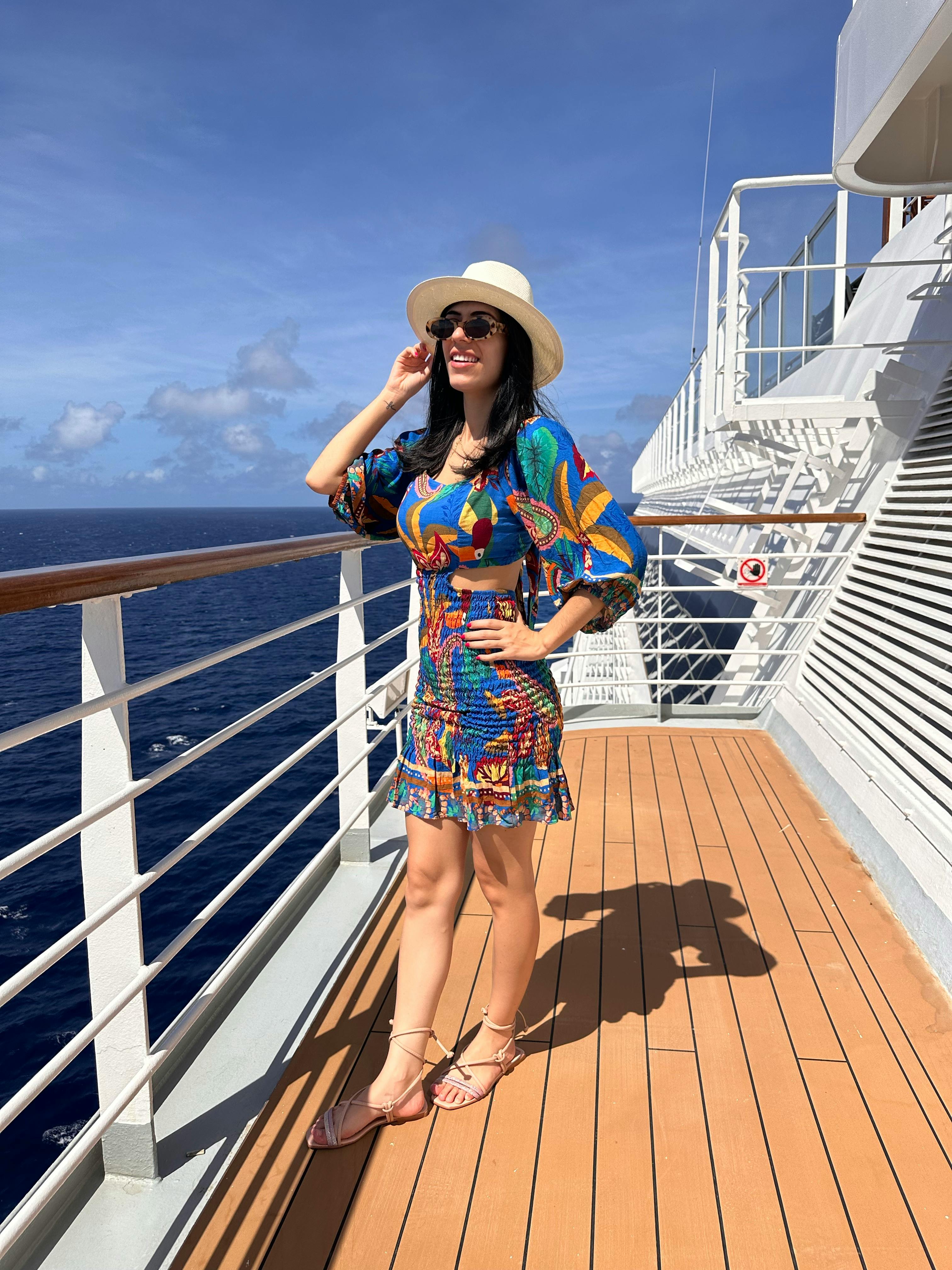 Brunette Woman in Hat and Dress Posing on Deck of Cruise Ship · Free ...
