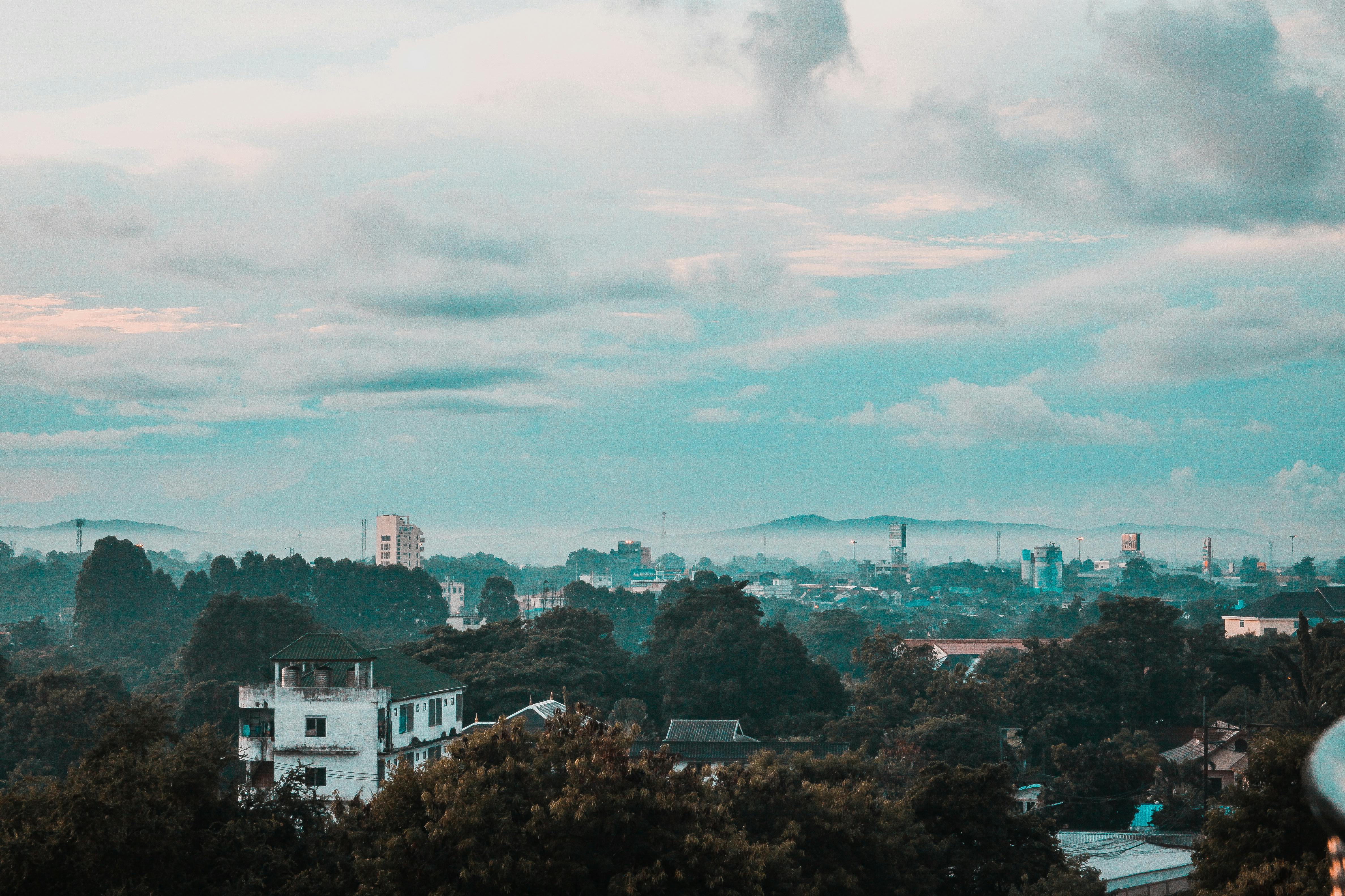 Grey Cloudy Blue Sky over City Skyline · Free Stock Photo
