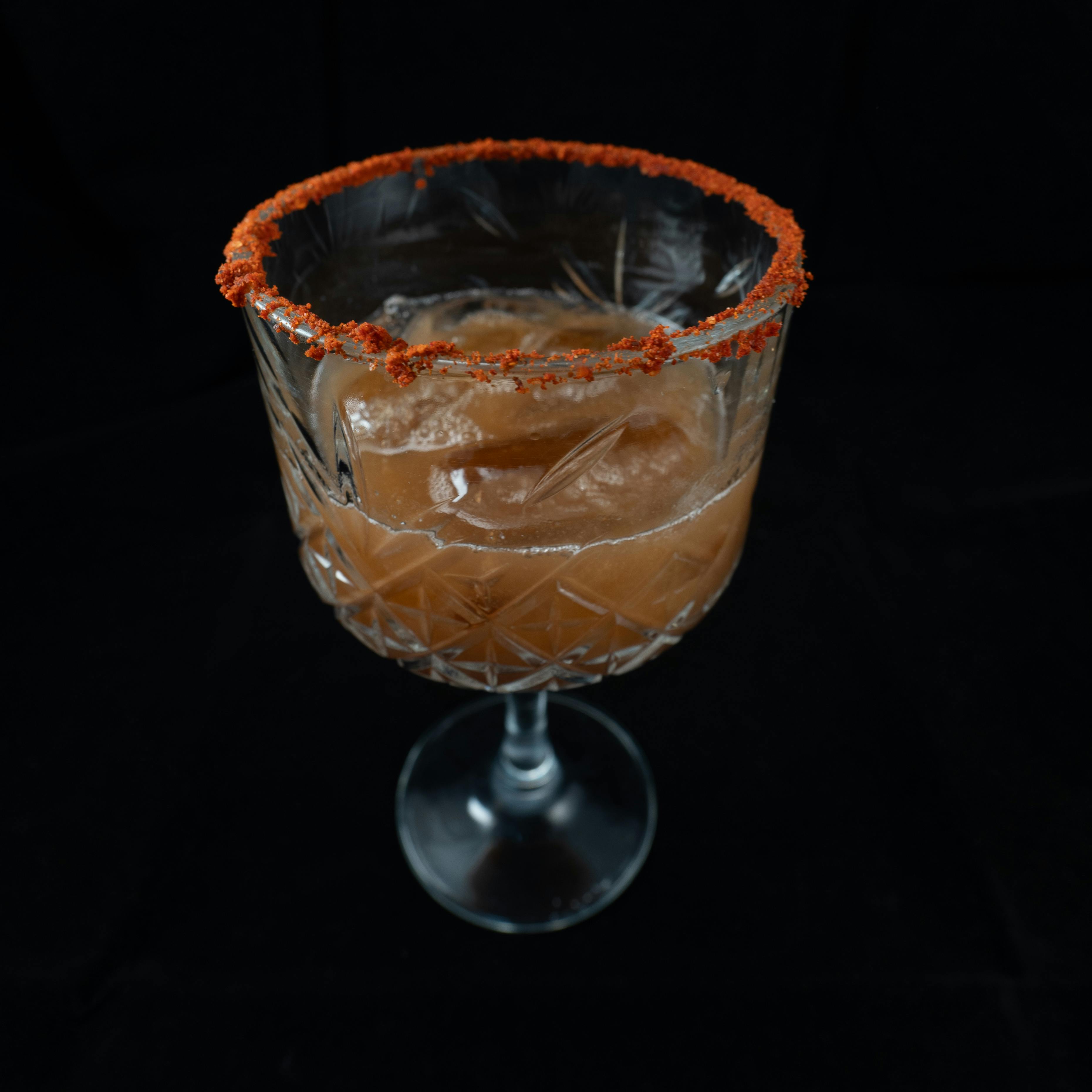 Brown Cocktail with Ice Cubes in a Glass with Spice on the Rim · Free ...
