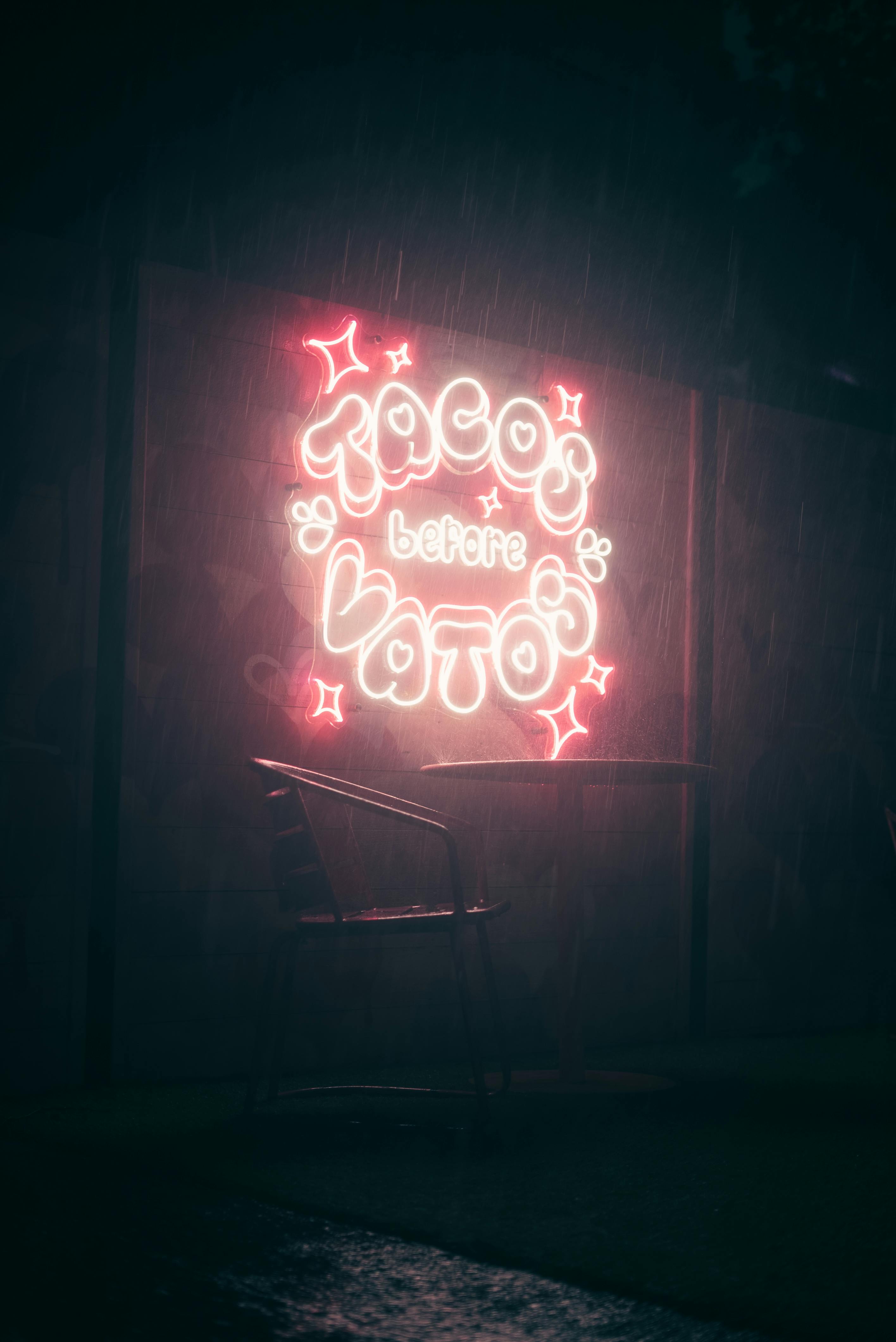 A neon sign with a neon light on it · Free Stock Photo