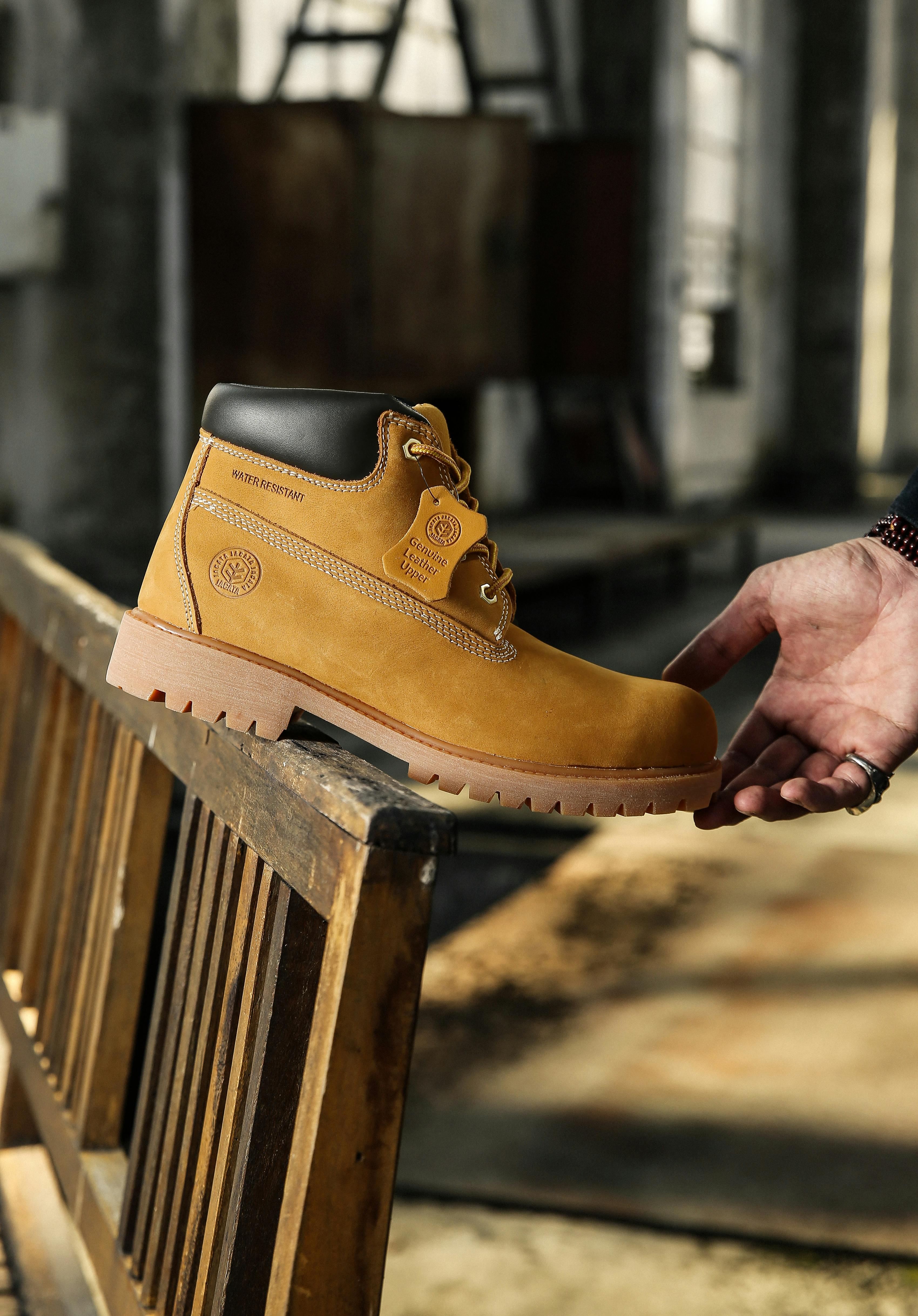 Man Hand Holding Boot · Free Stock Photo