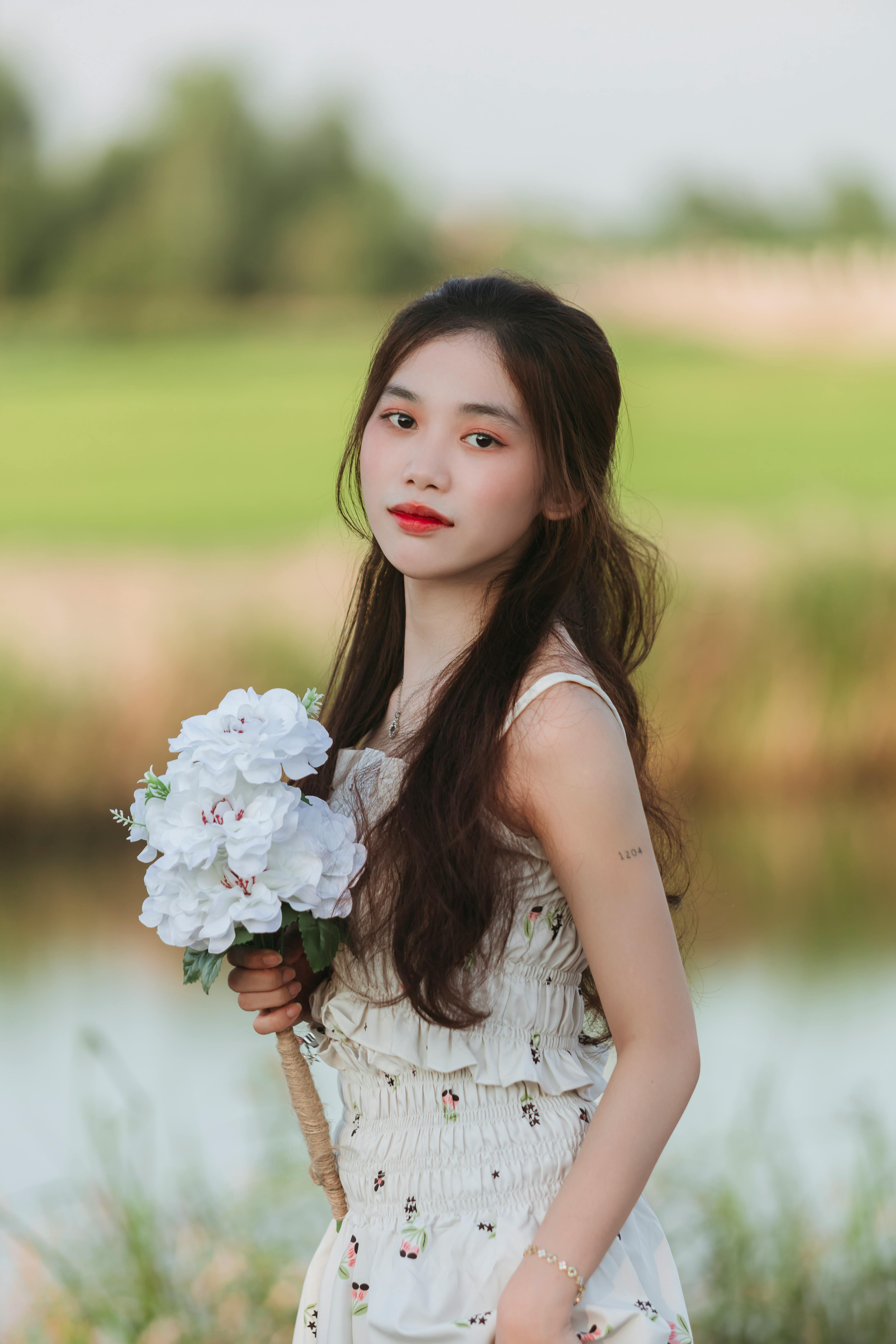 Sunlit Outdoor Portrait of Smiling Woman · Free Stock Photo