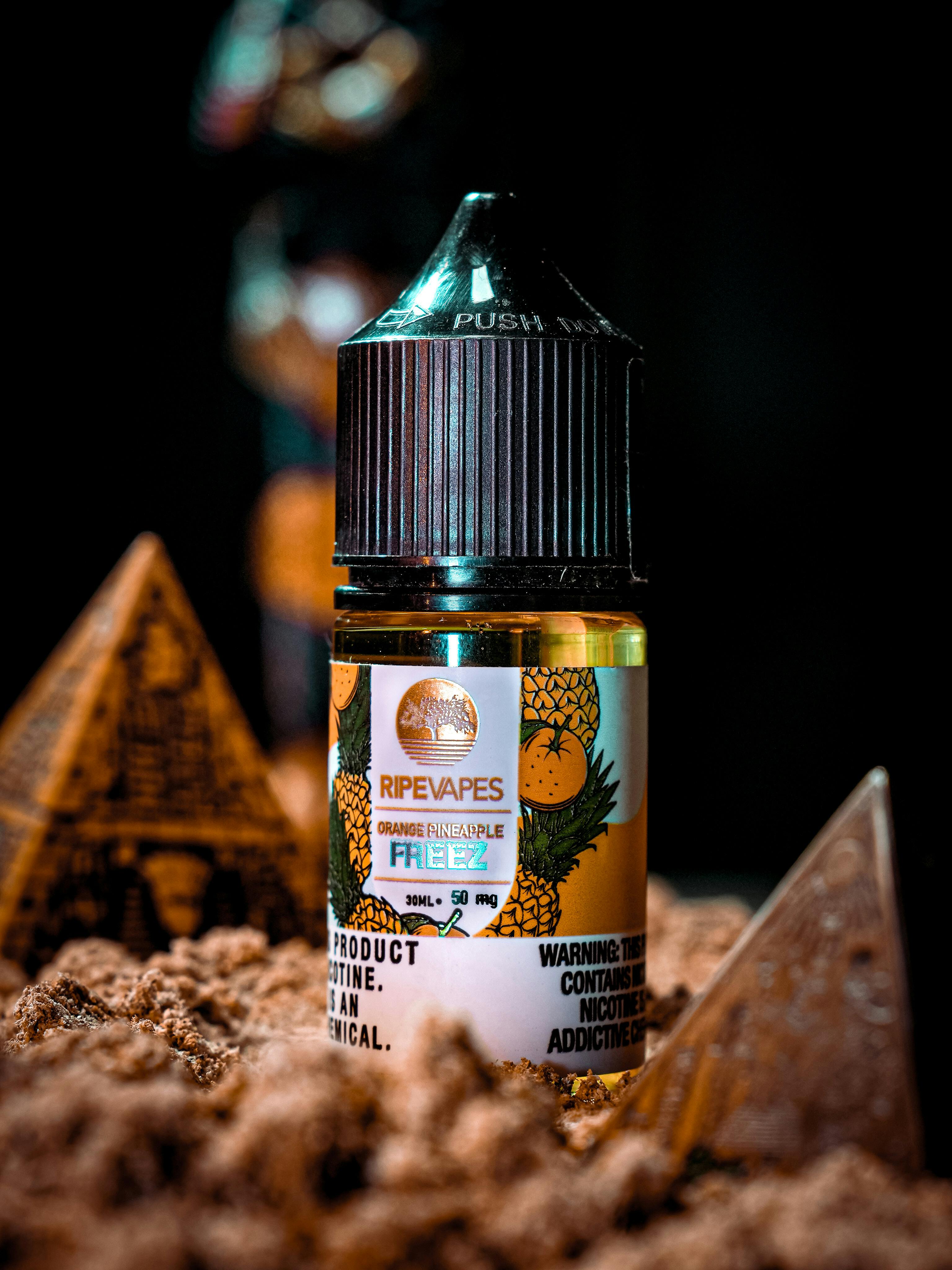 Pineapple Vape Liquid in Plastic Bottle · Free Stock Photo