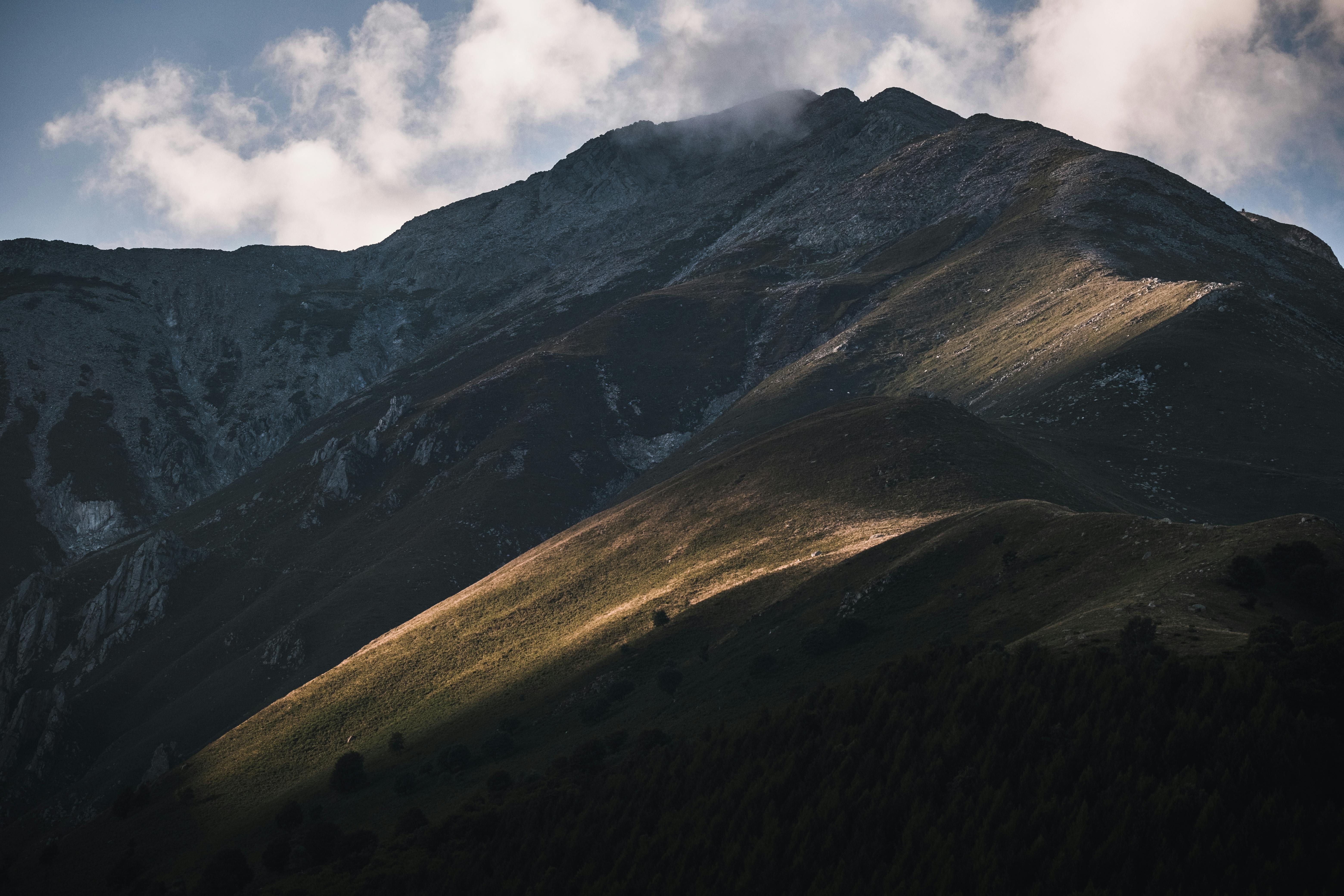 Majestic Mountains in Shadow and Sunlight · Free Stock Photo