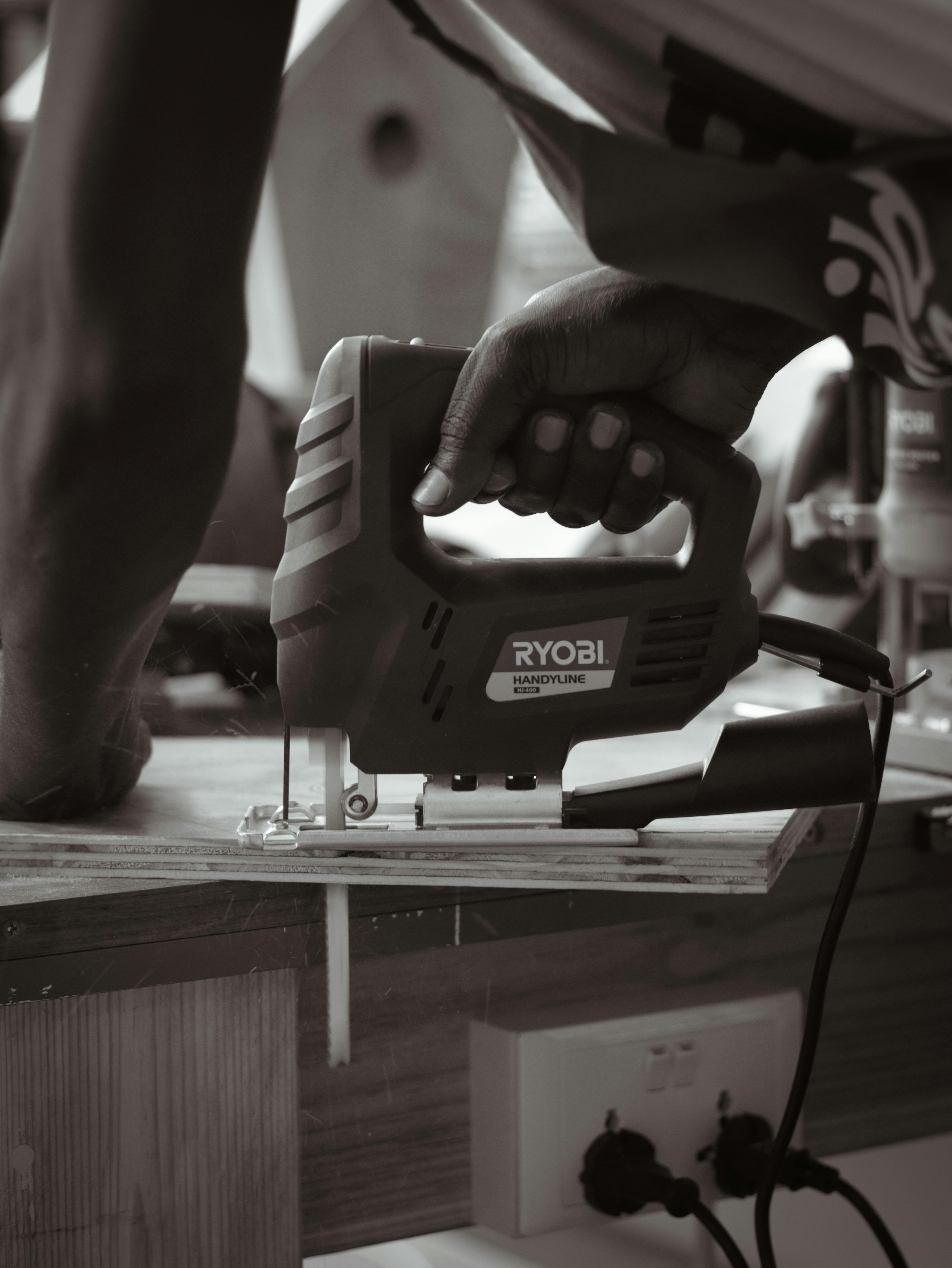 jigsaw cutter used to cut wood boards · Free Stock Photo