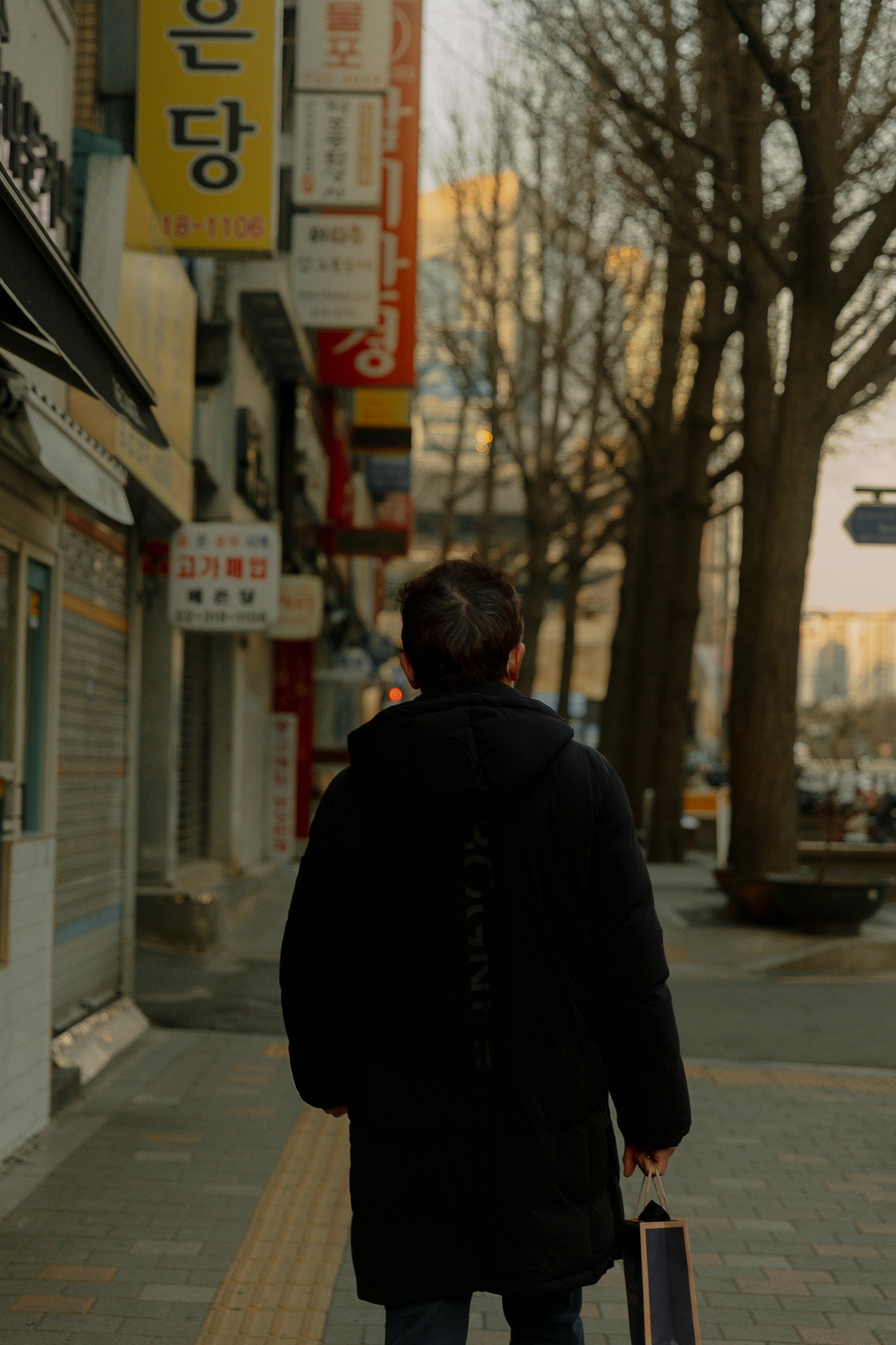 Back View of a Man Walking the Street · Free Stock Photo