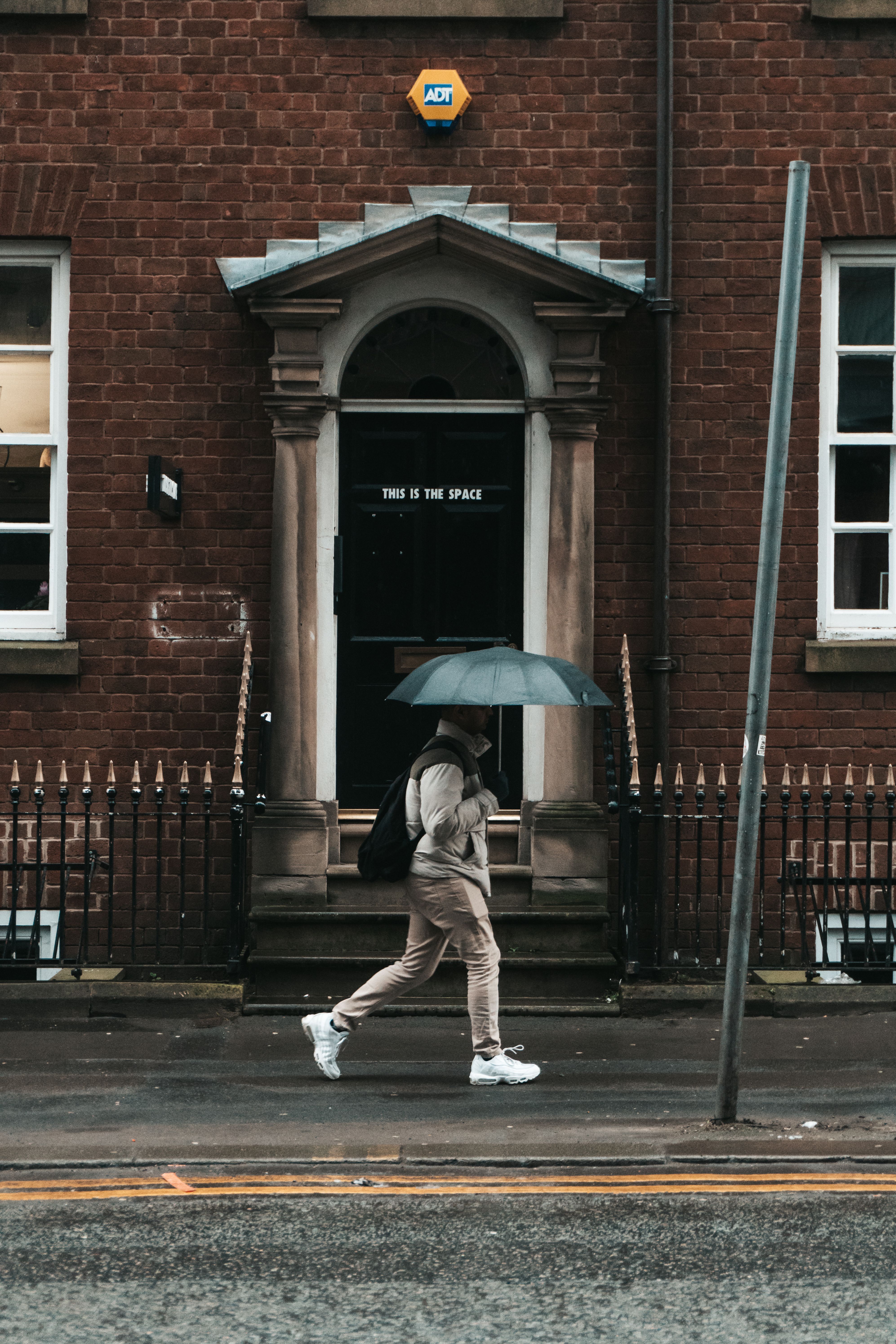 Man Walking with Umbrella in Rain · Free Stock Photo