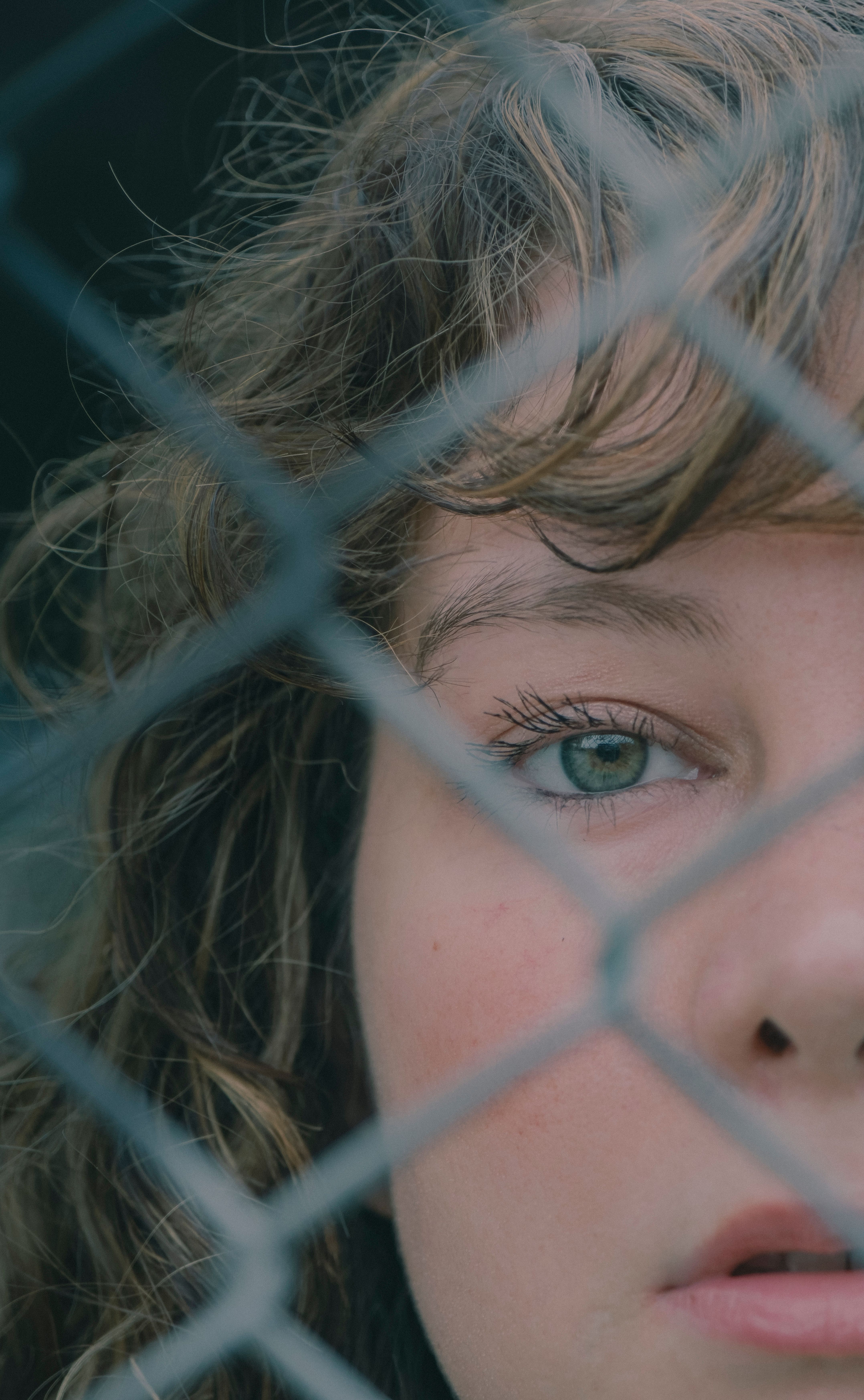 Woman Face behind Fence Net · Free Stock Photo