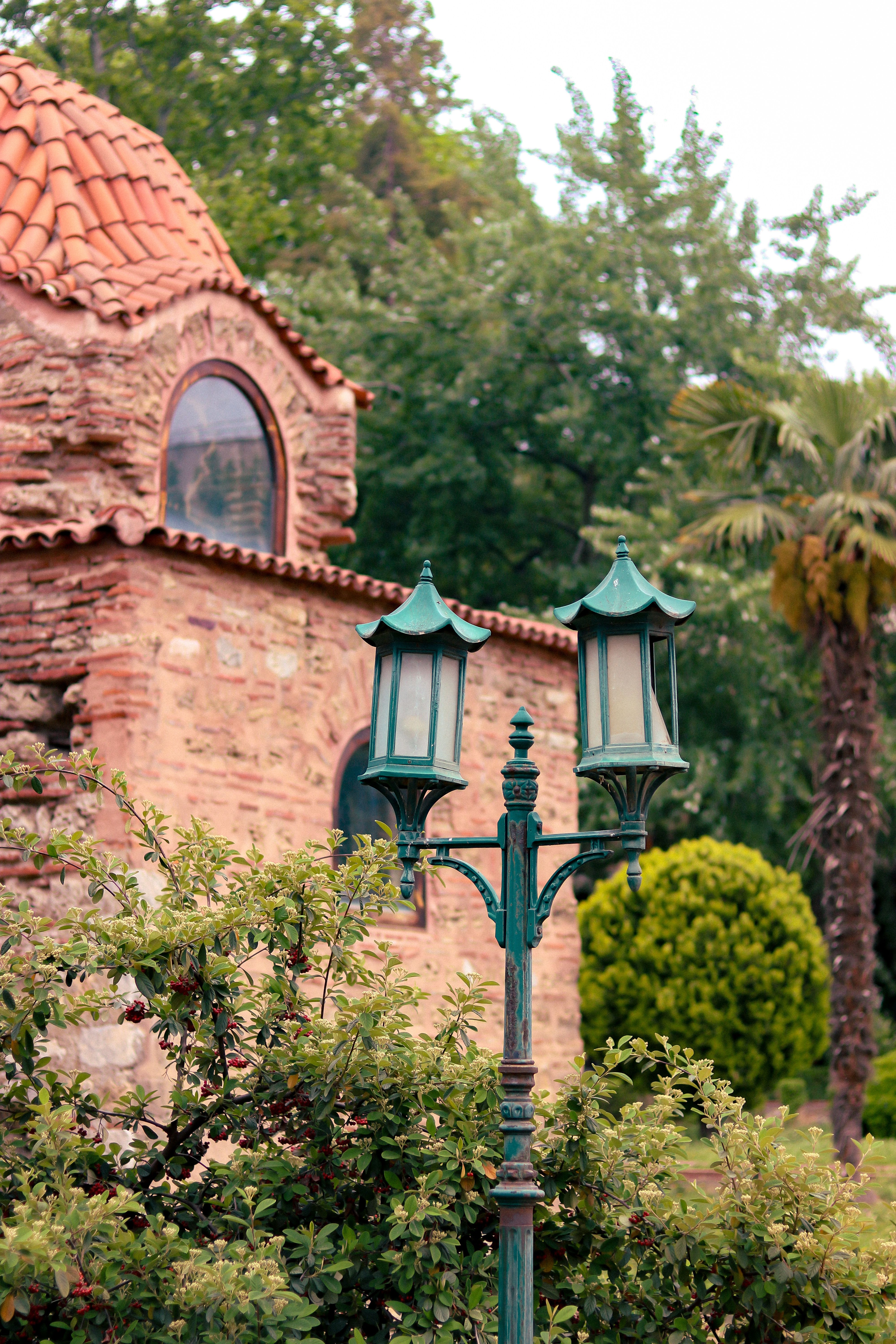Street Lamp near Vintage Building in Park · Free Stock Photo