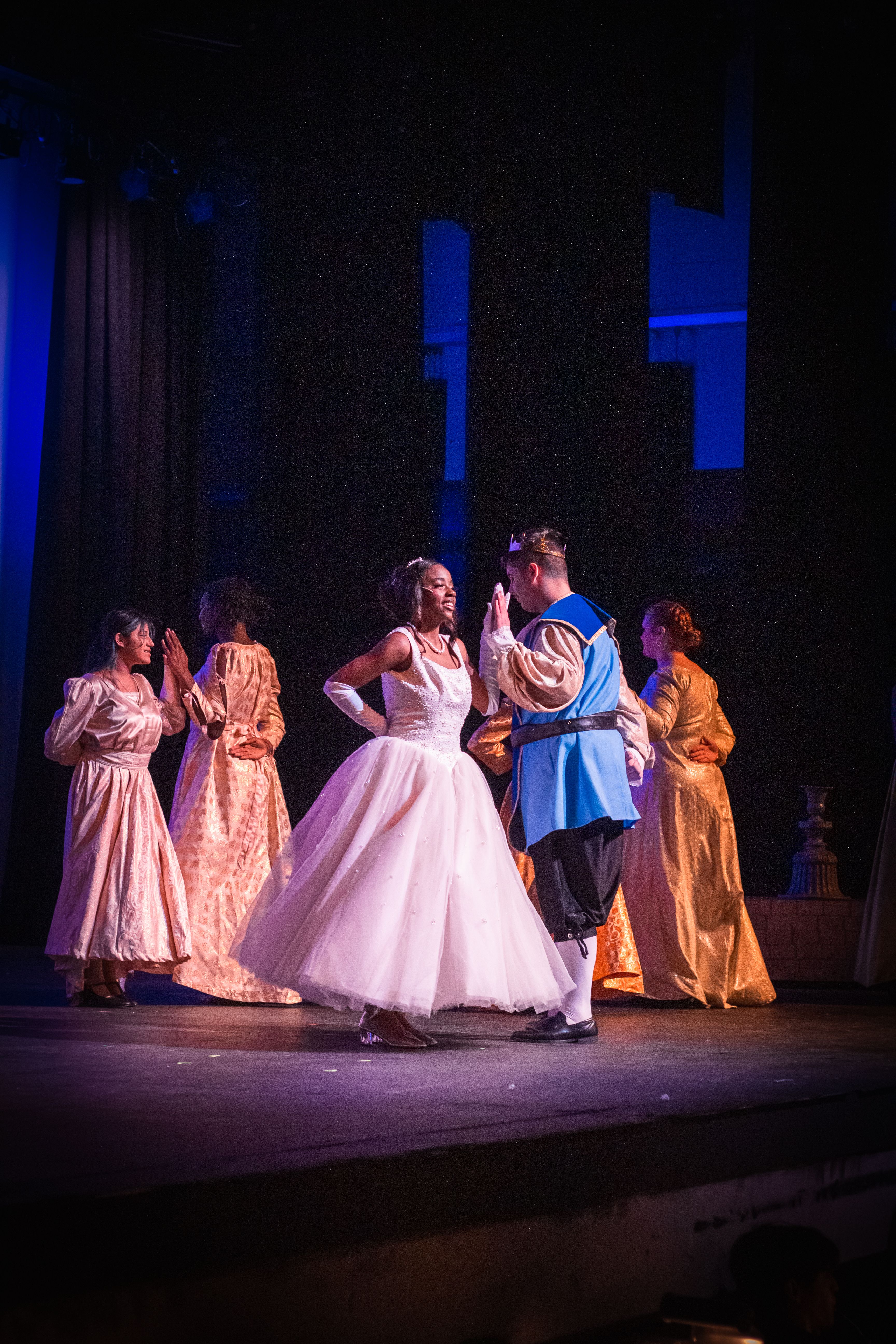A couple in formal dresses dancing on stage · Free Stock Photo