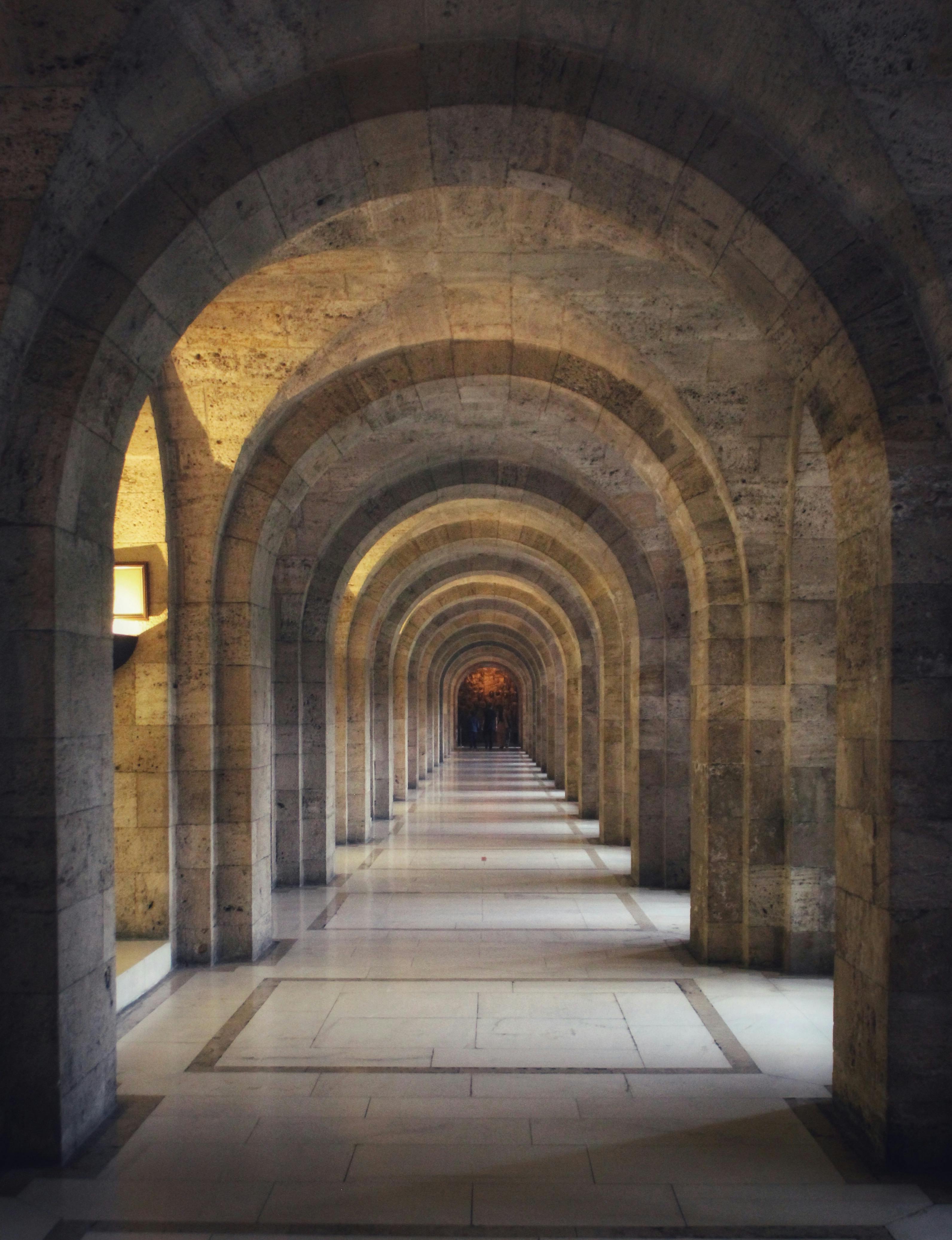 The arches of the old parliament building in paris · Free Stock Photo