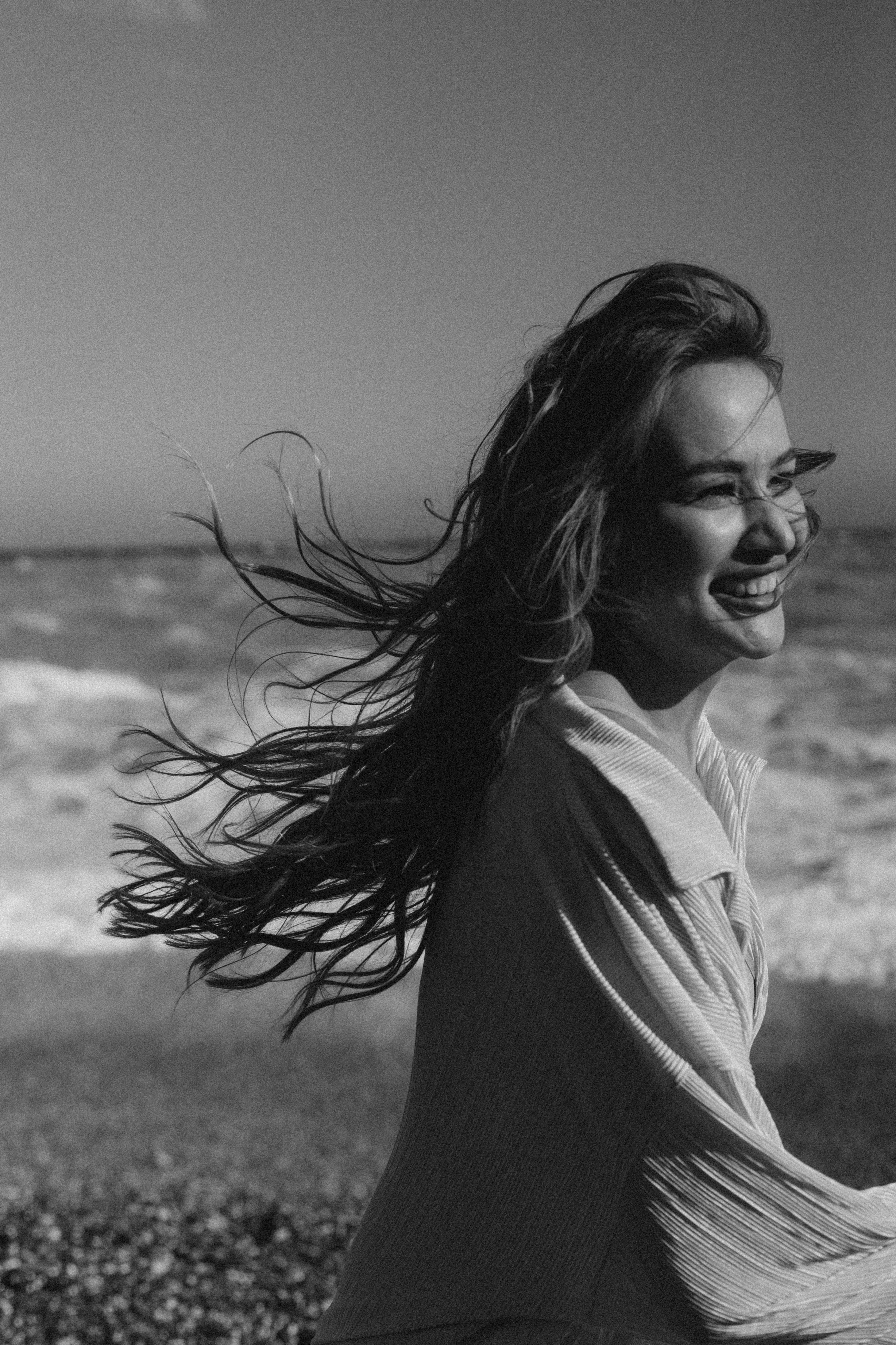 Portrait of Smiling Woman on Sea Shore · Free Stock Photo