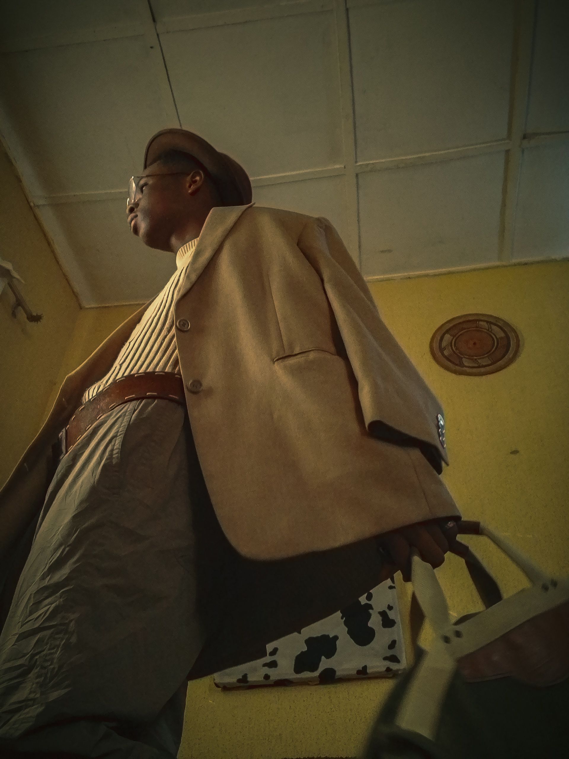 Low Angle Shot of a Young Man in a Fashionable Outfit · Free Stock Photo