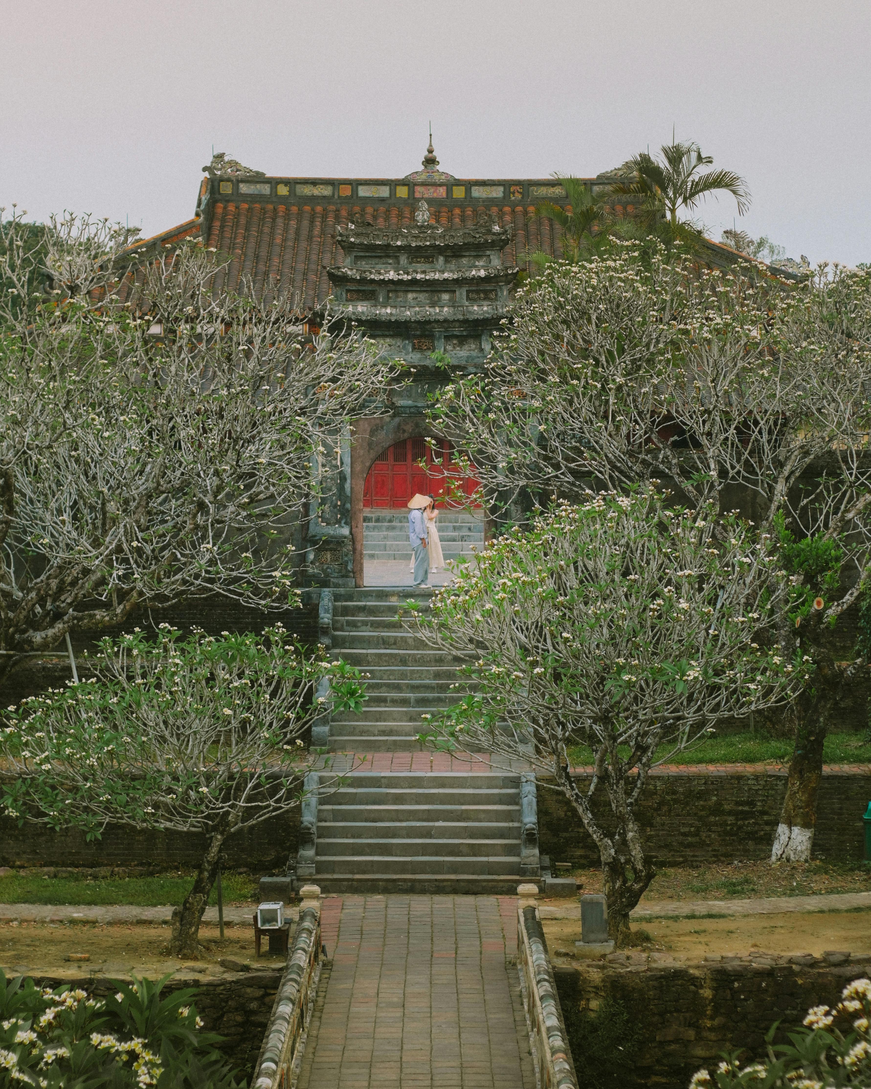 A chinese temple with a pathway leading to it · Free Stock Photo