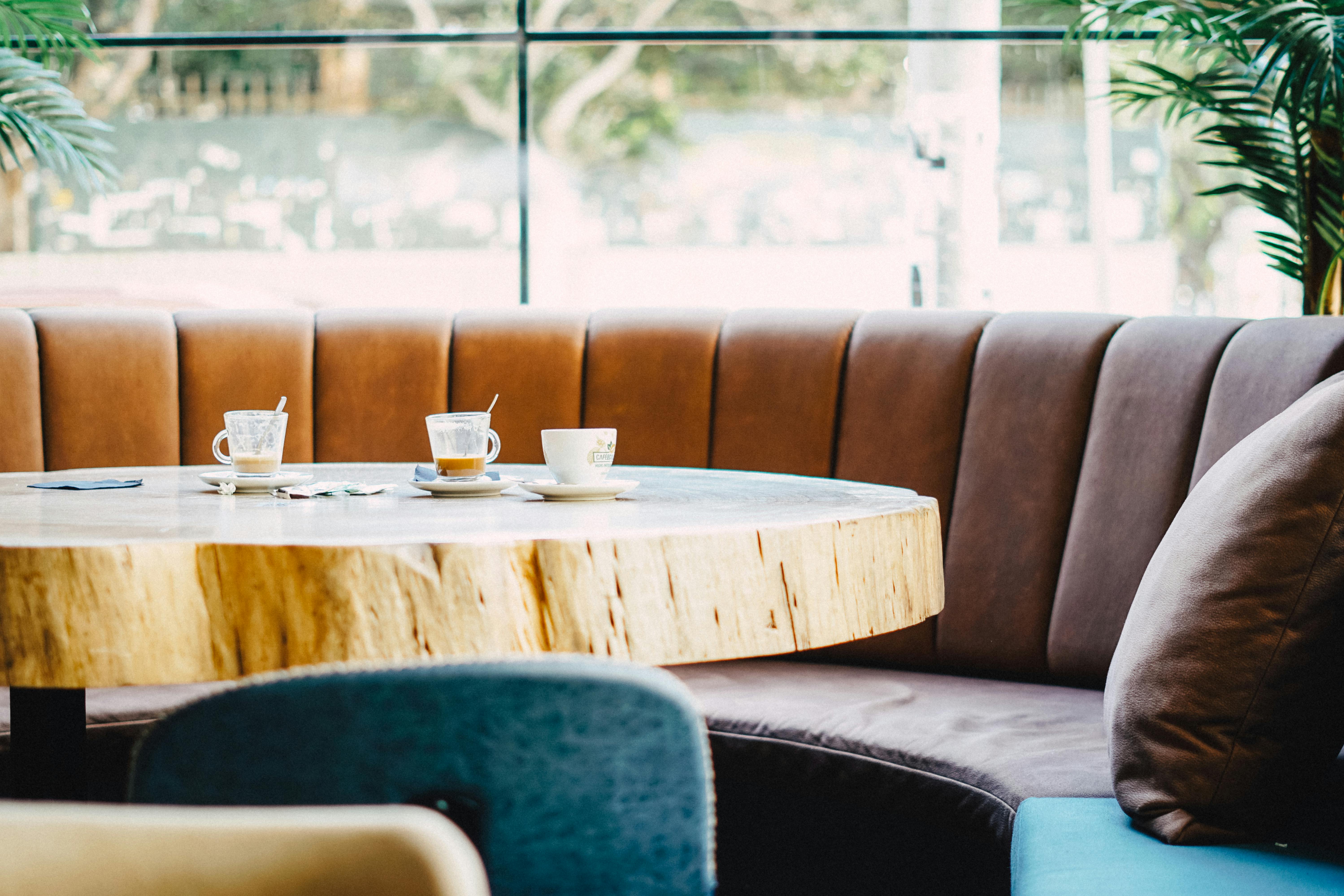 Interior of modern cafe with tables and chairs · Free Stock Photo