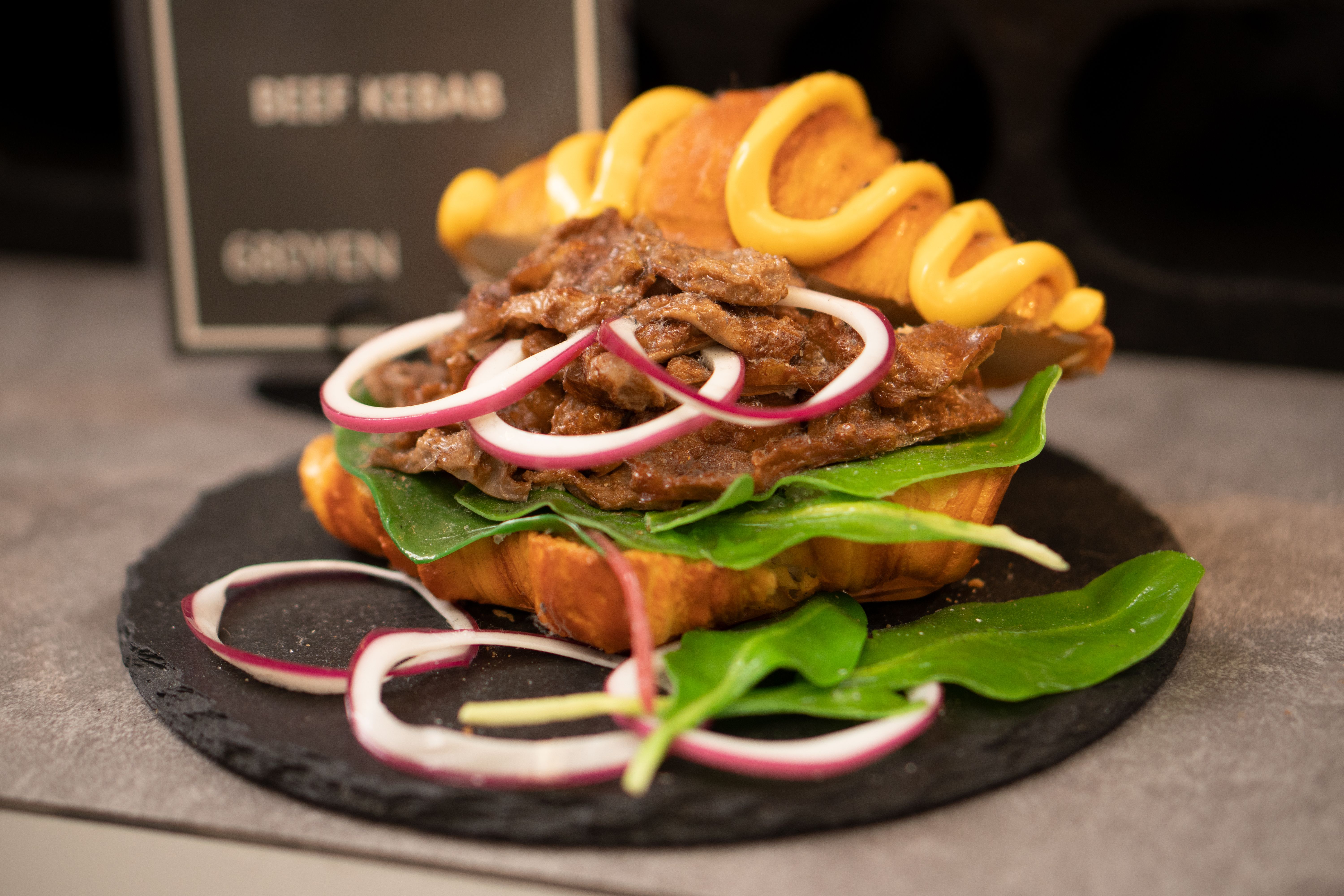 Croissant with Meat Red Onion and Arugula · Free Stock Photo