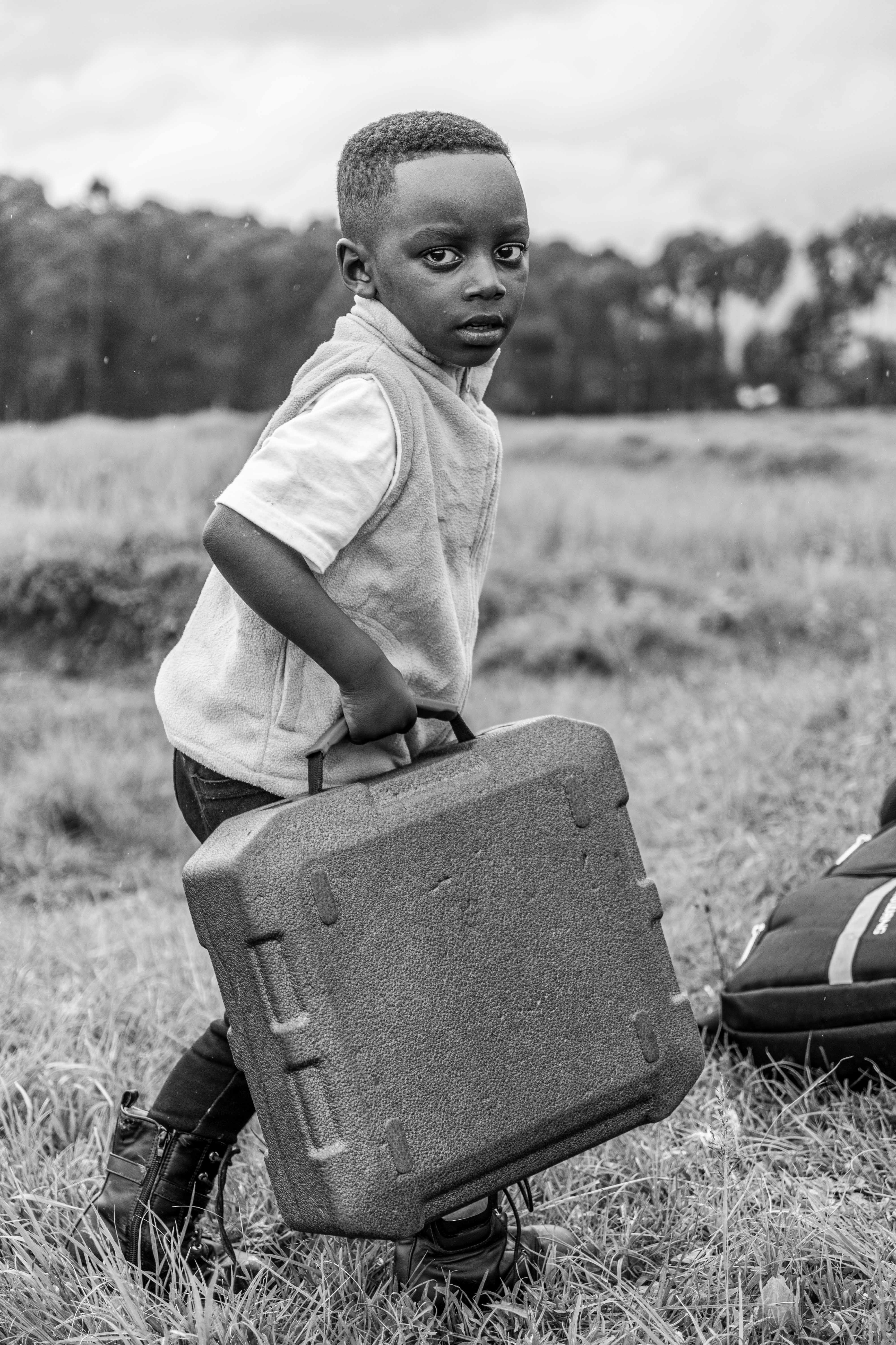 Boy carrying Heavy Tool Case · Free Stock Photo