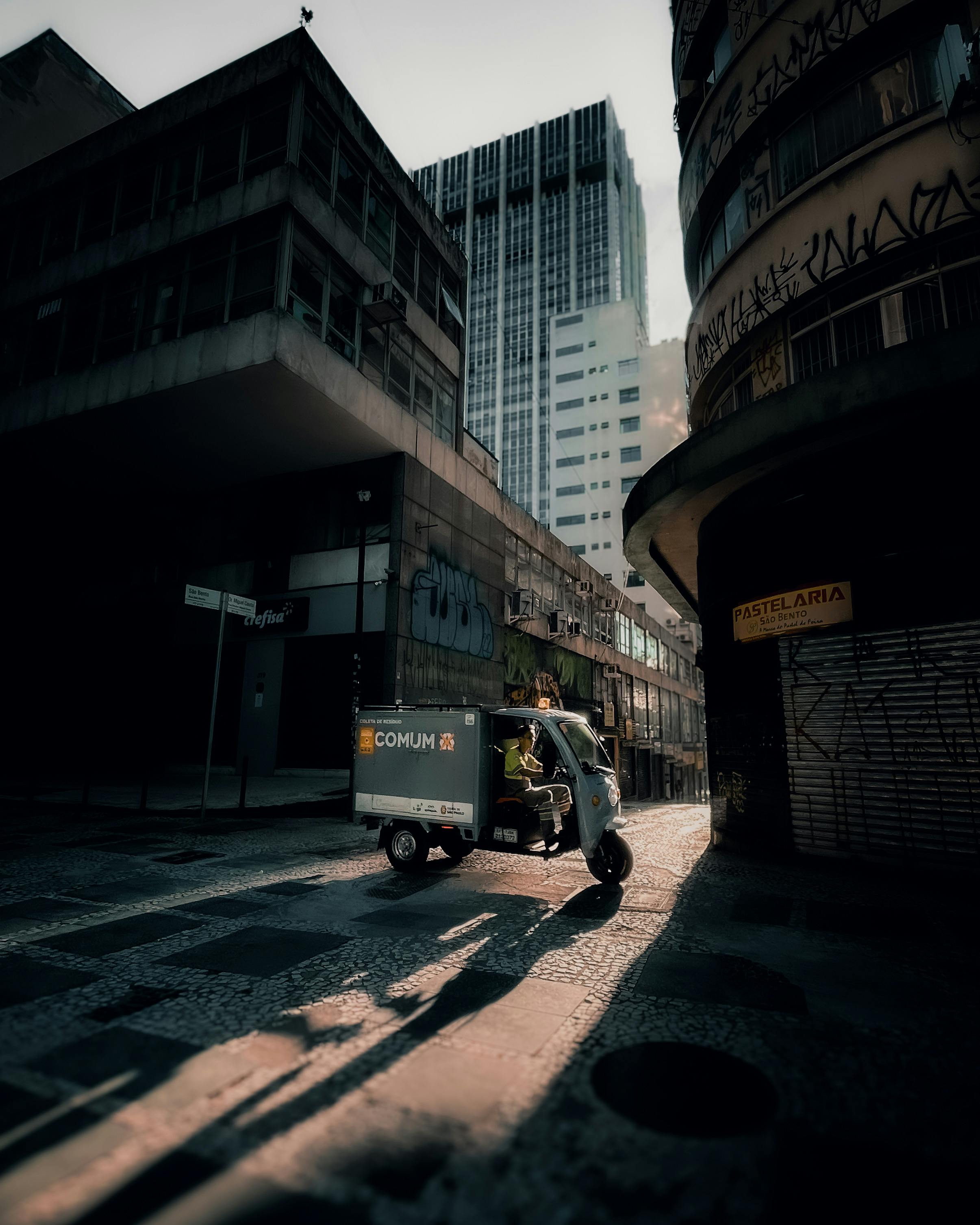 Man Driving Three-Wheeler in City · Free Stock Photo