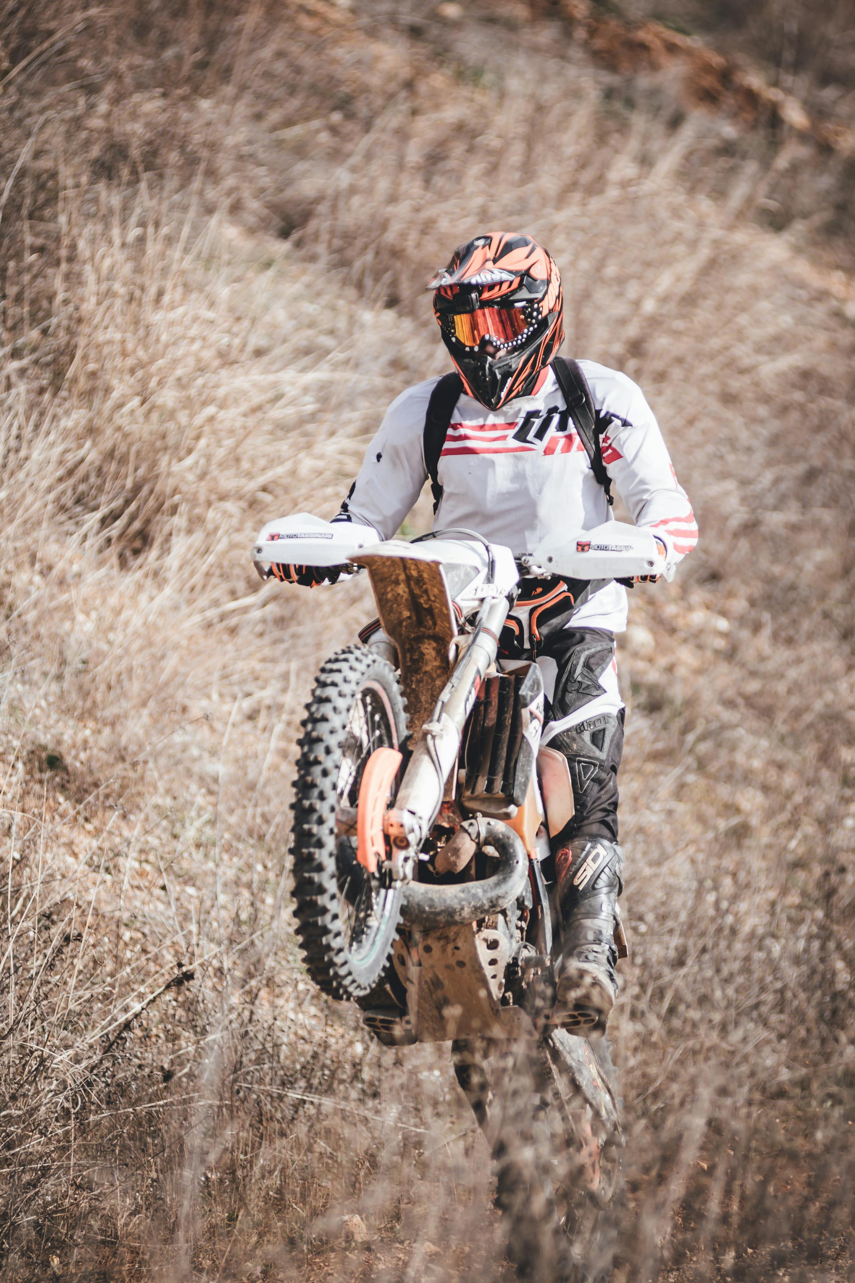 Person Riding White Dirt Bike Mid Air · Free Stock Photo