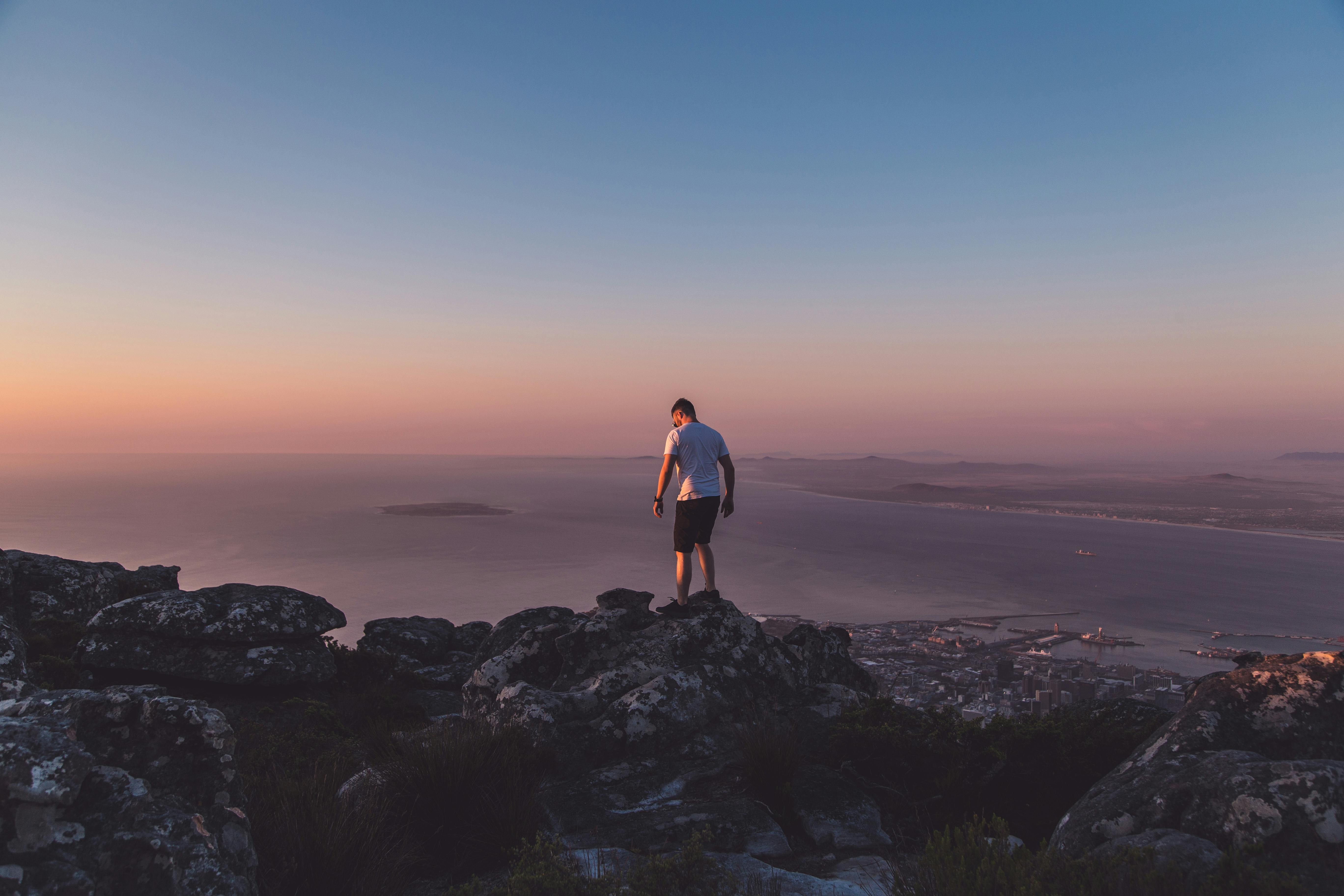 Man Standing On Rock · Free Stock Photo