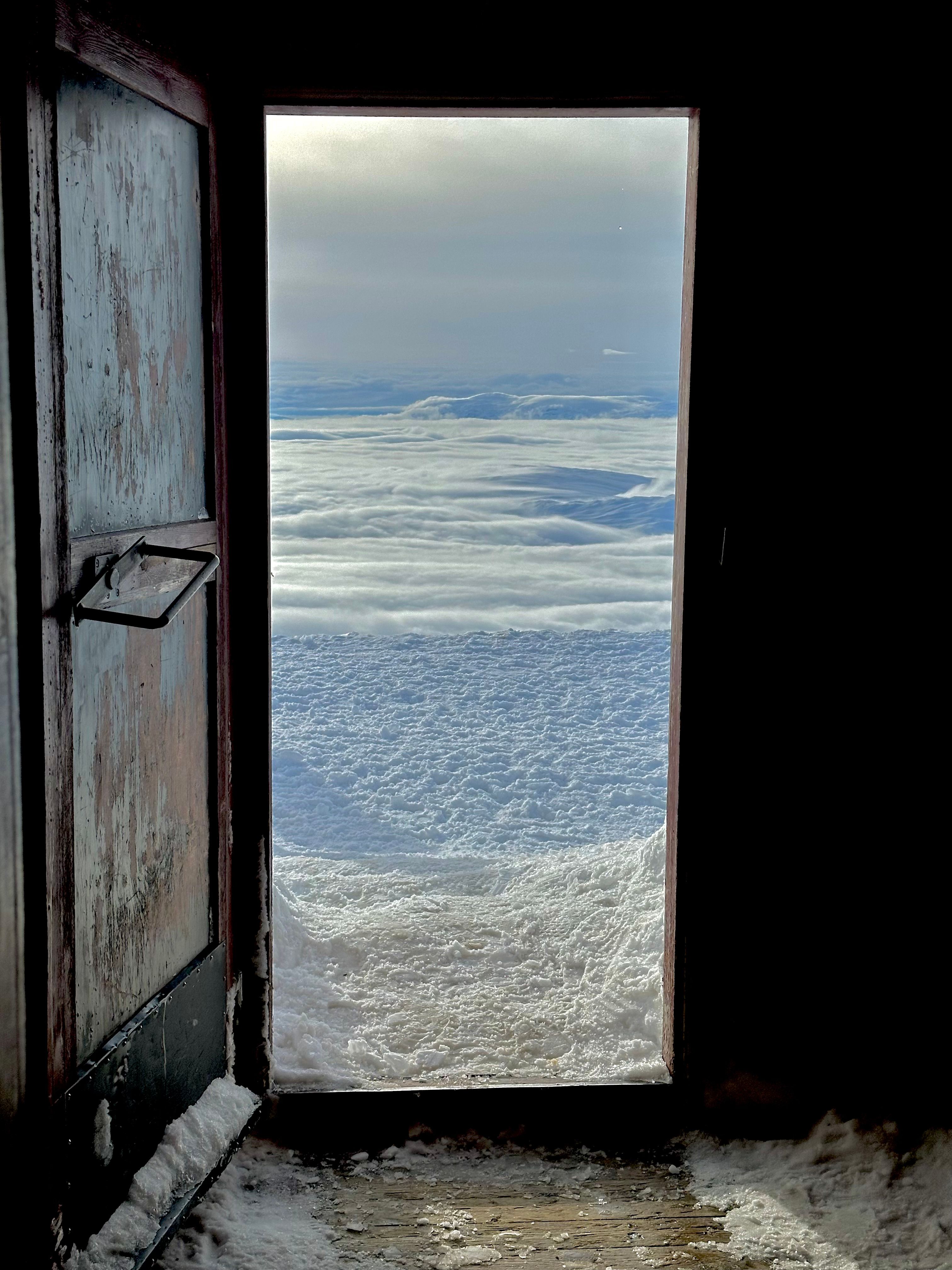 Snow behind Open Door of Abandoned Room · Free Stock Photo