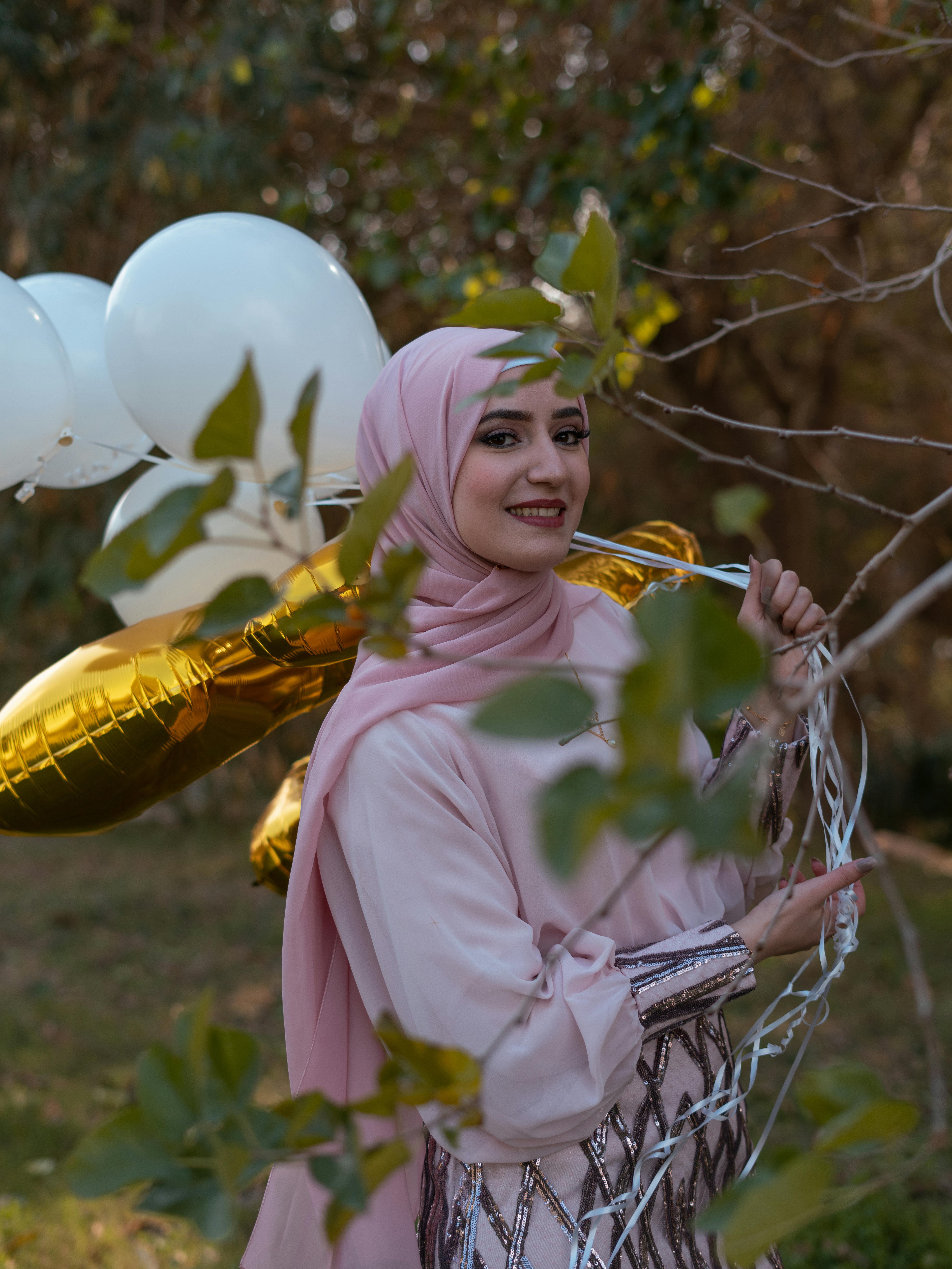 Smiling Woman in Hijab and with Balloons · Free Stock Photo