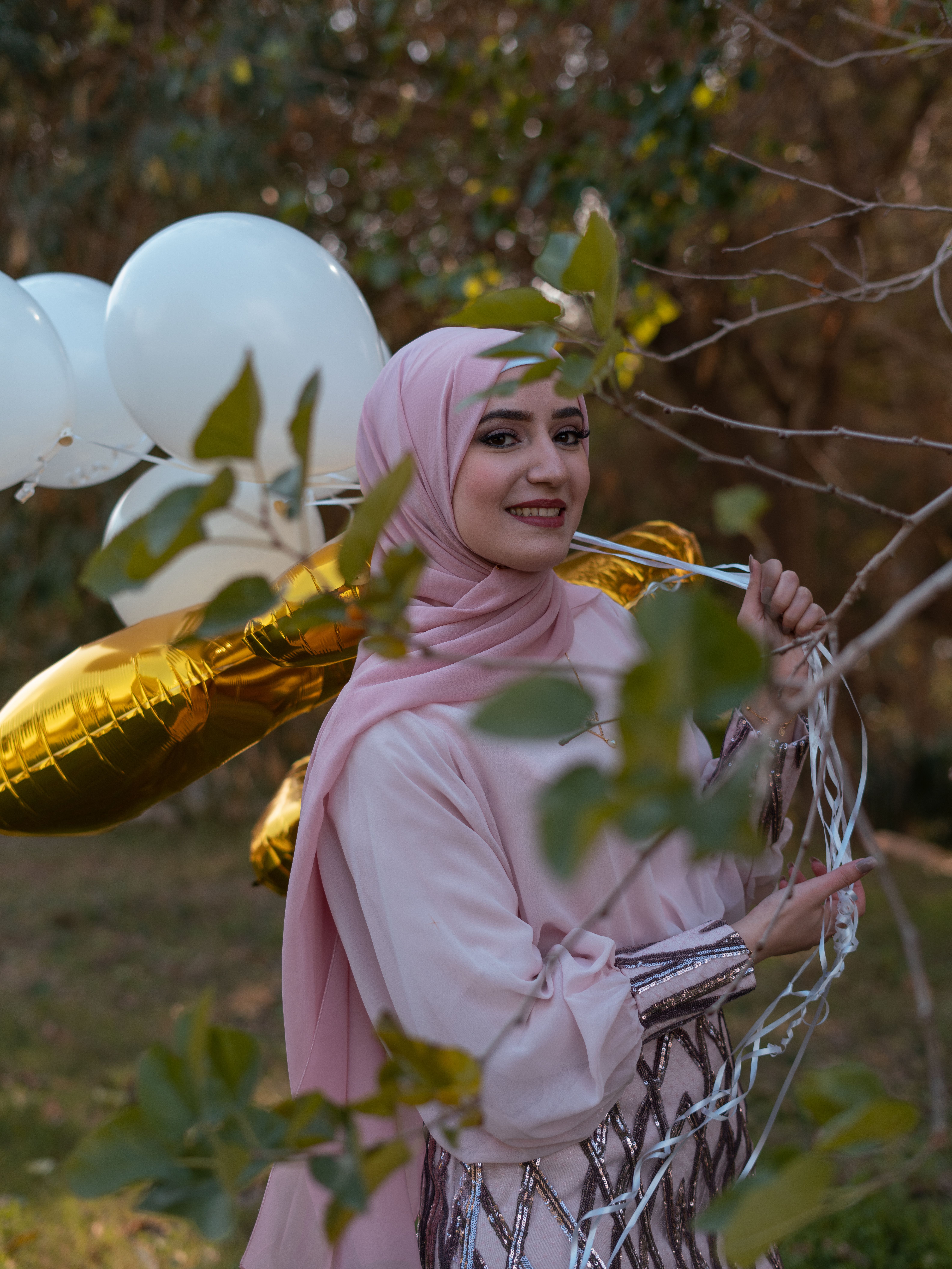 Smiling Woman in Hijab and with Balloons · Free Stock Photo