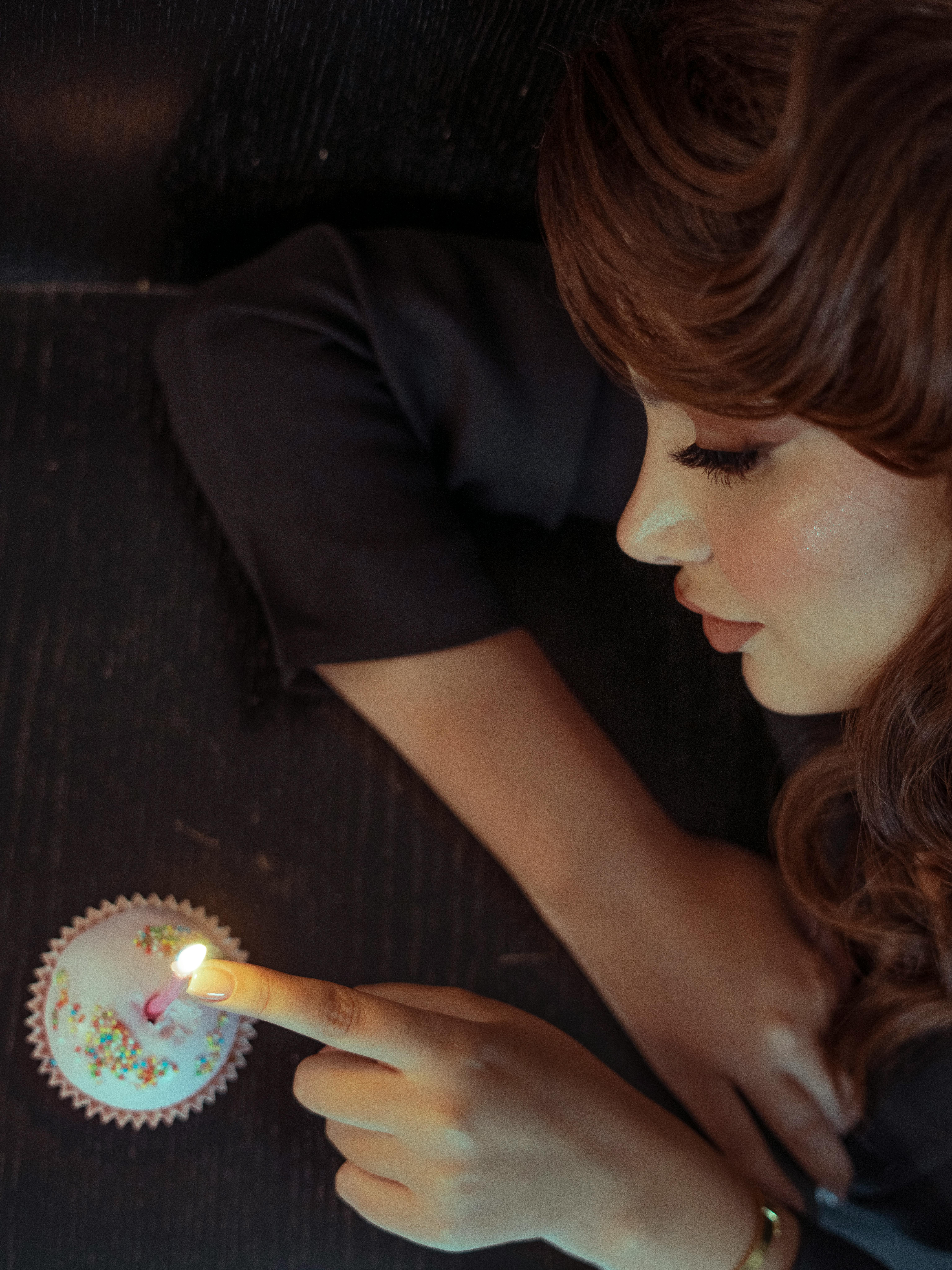People Touching a Minimalist Cake · Free Stock Photo