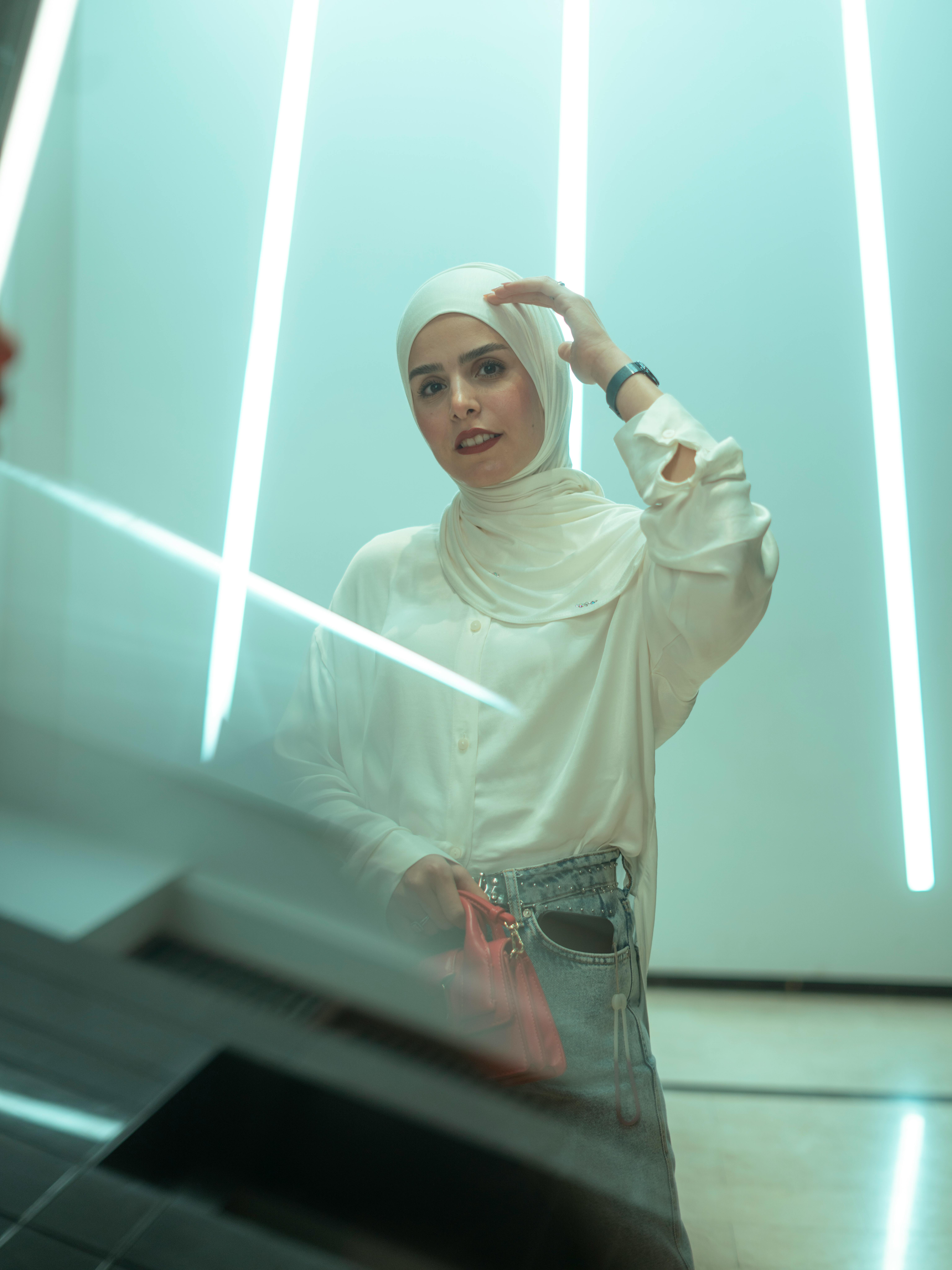 Standing Woman in White Blouse Holding Red Bag · Free Stock Photo