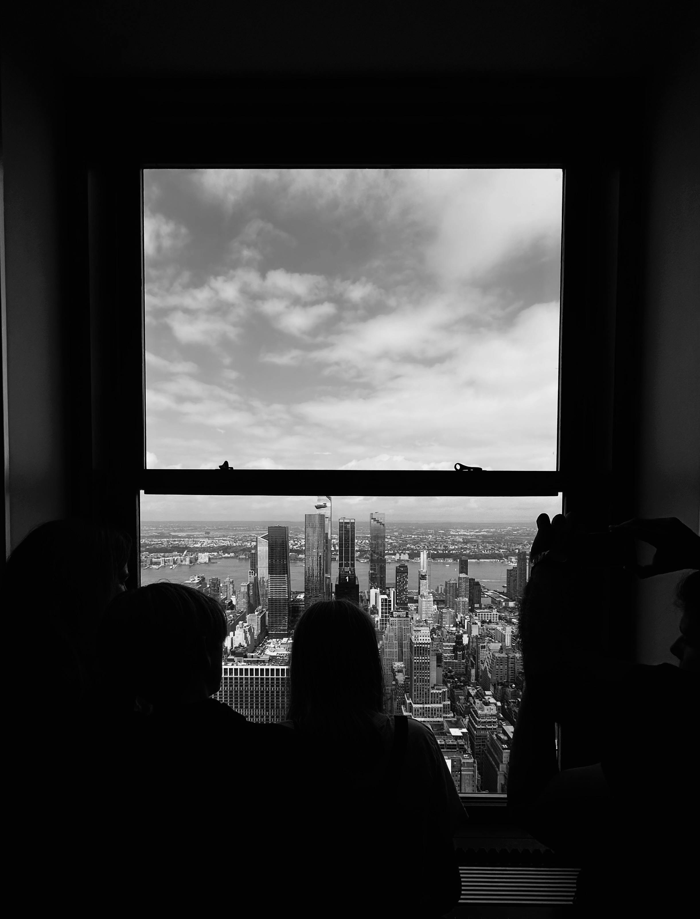 Black and White Photography of People Looking through the Window at a ...