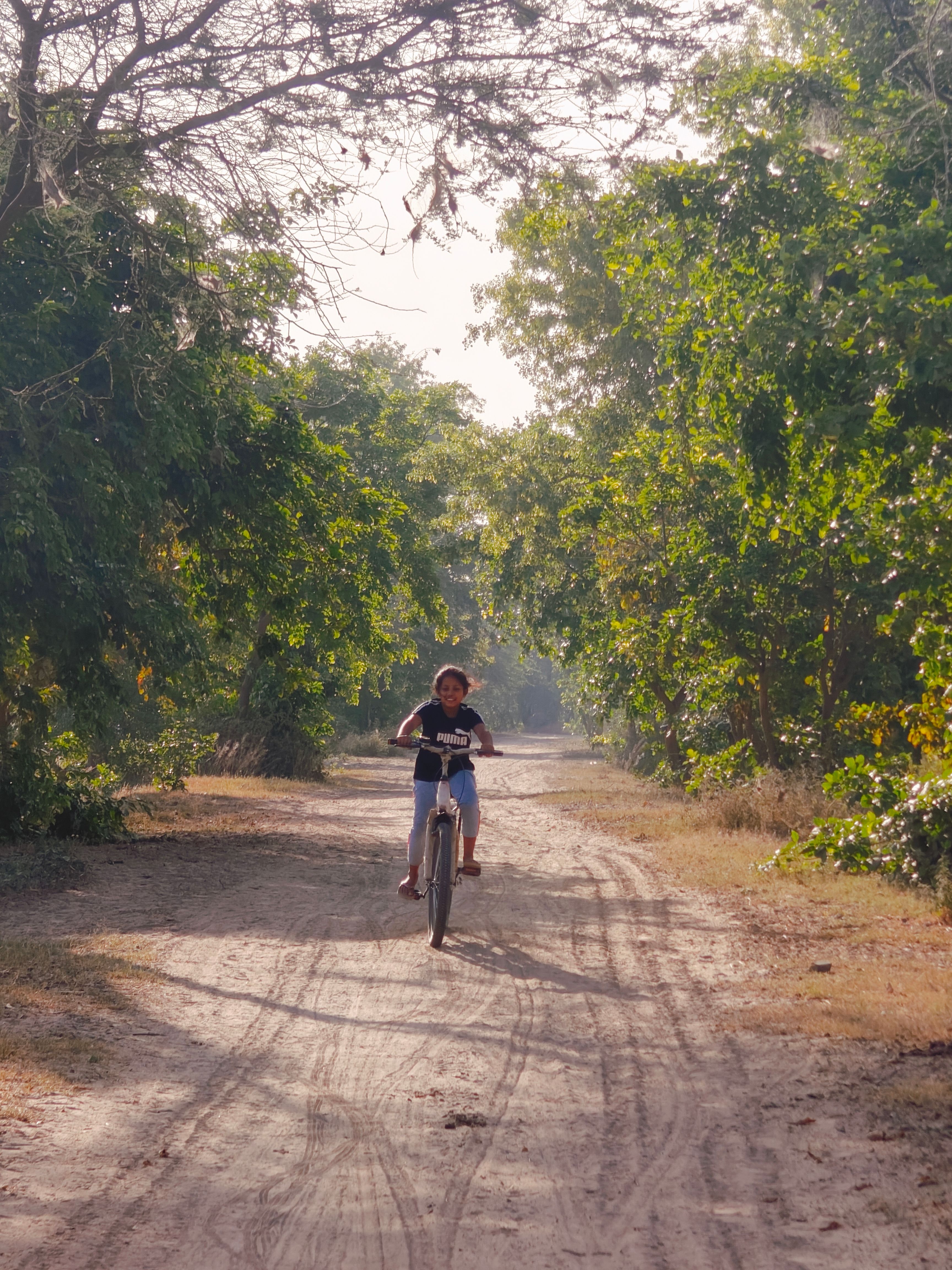 Girl Riding Bike on Country Road · Free Stock Photo