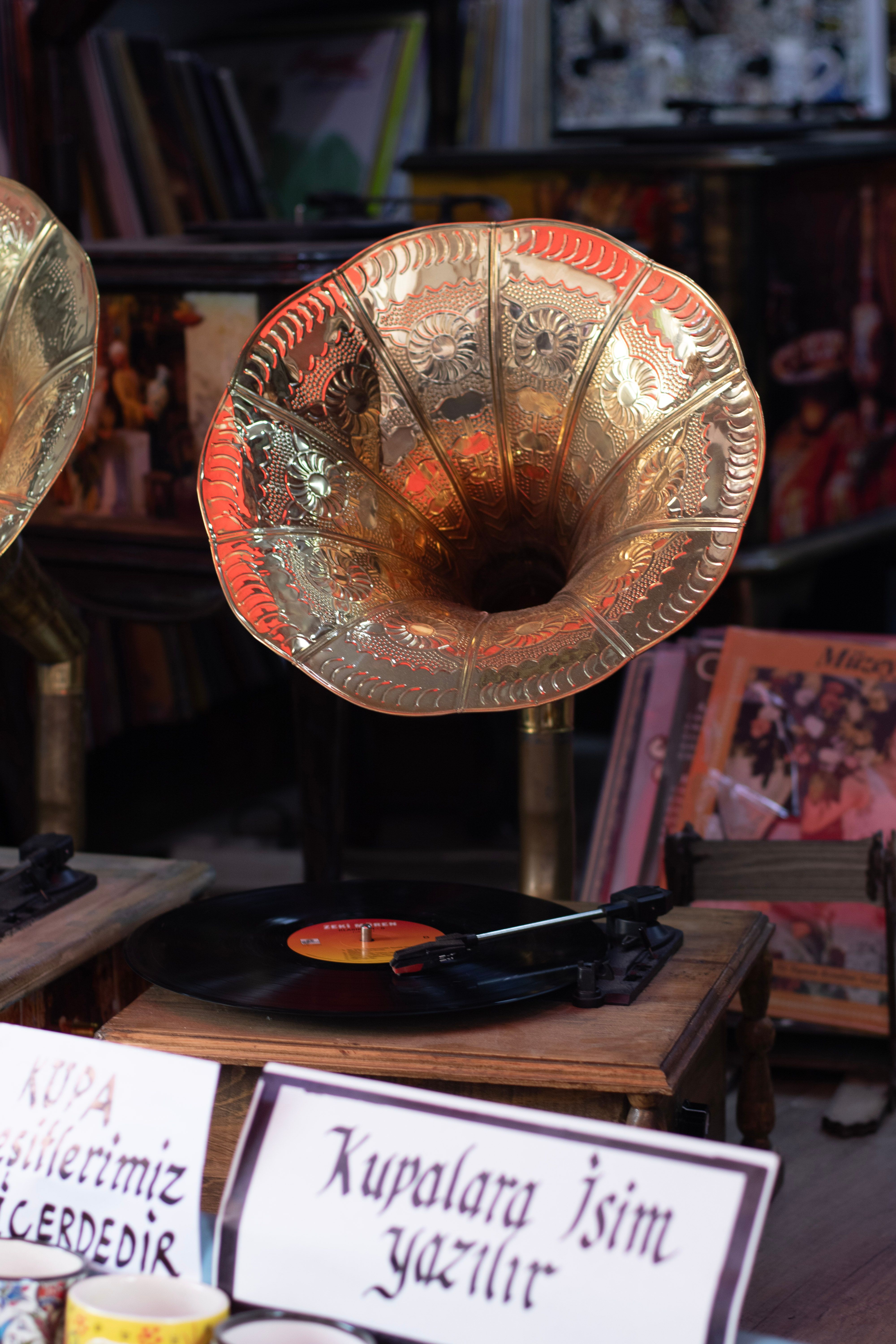 A pair of antique brass gramophones on display · Free Stock Photo