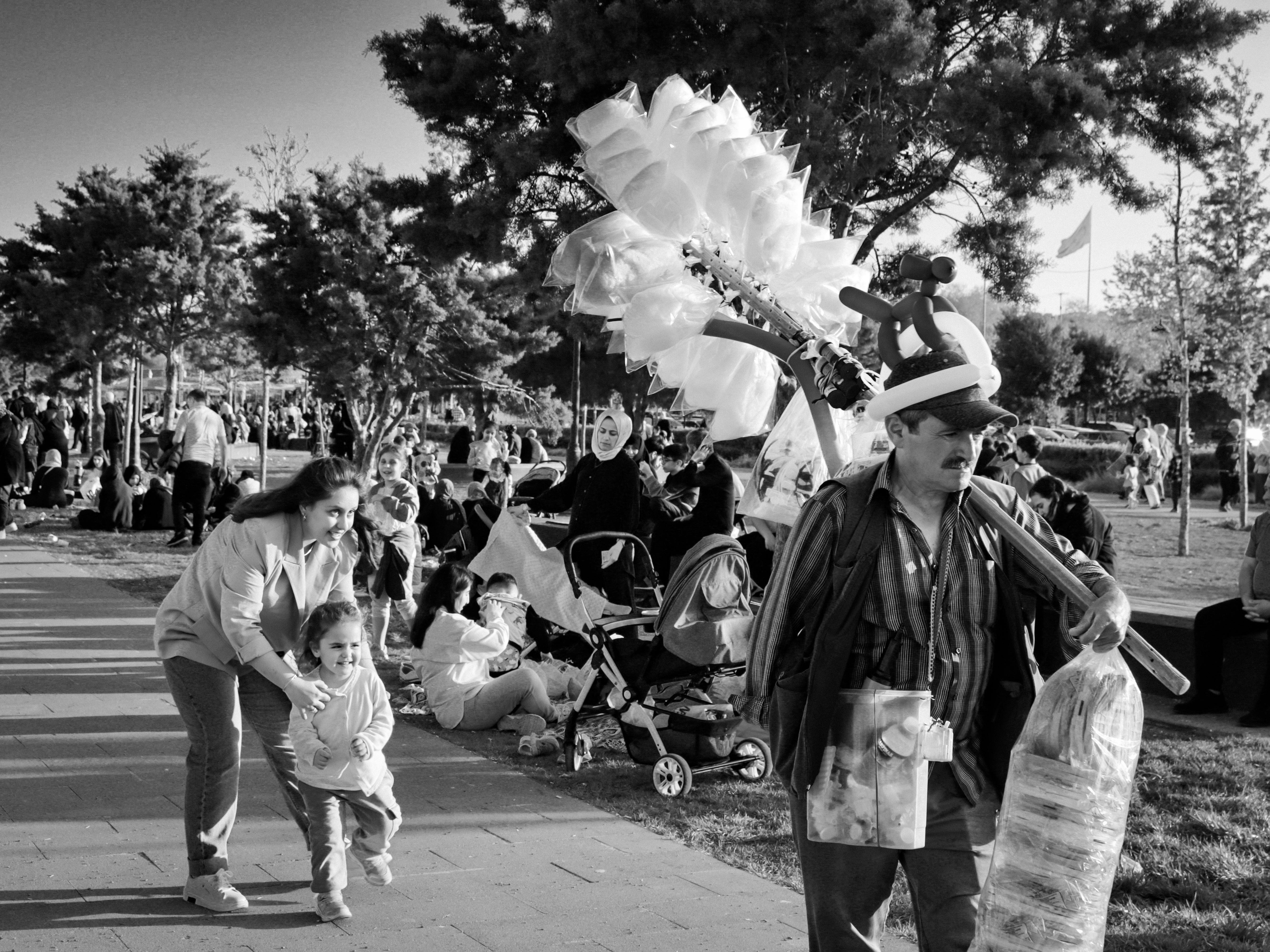 Man Carrying Cotton Candy in Festival at Park · Free Stock Photo