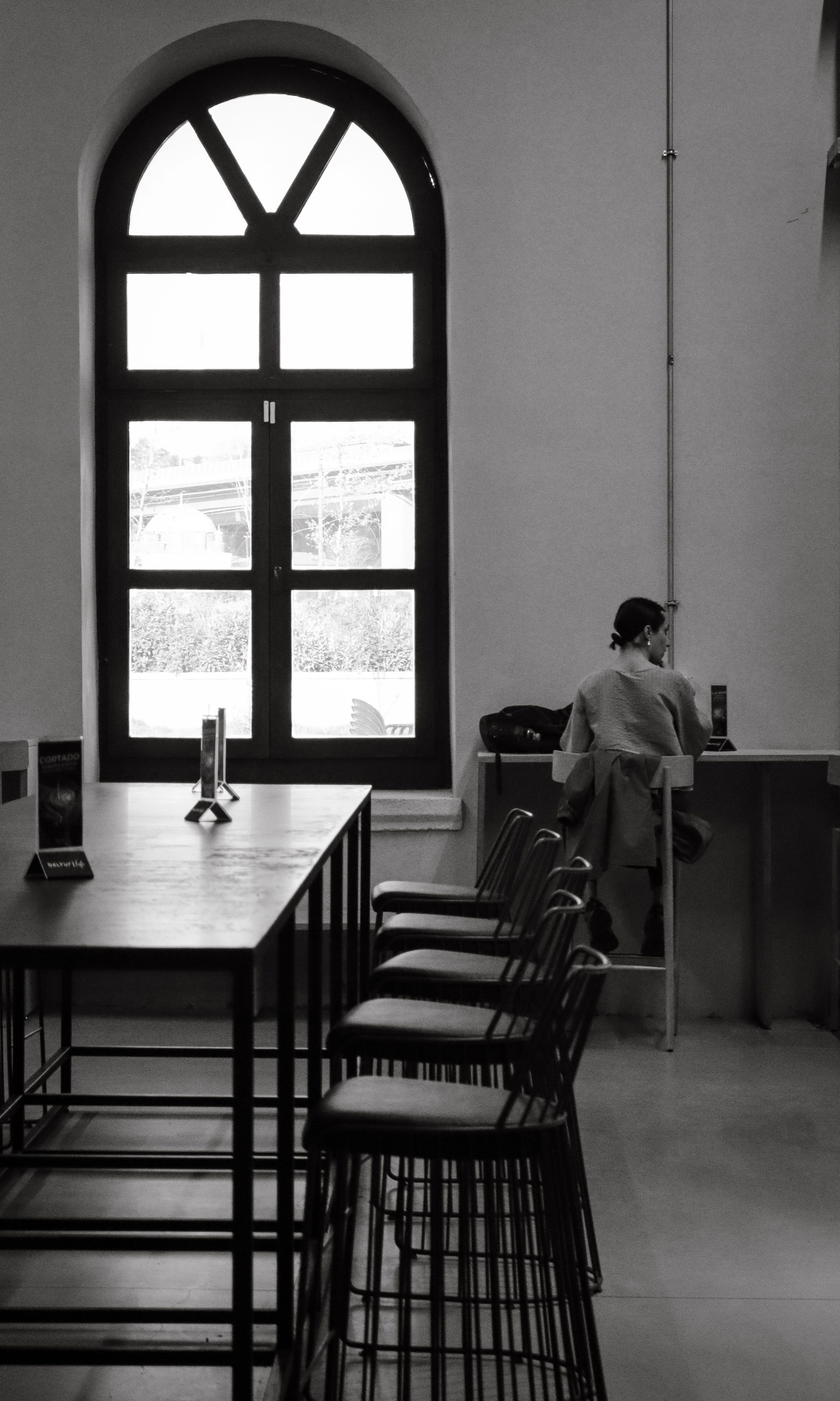Woman behind Table and Chairs in Room · Free Stock Photo